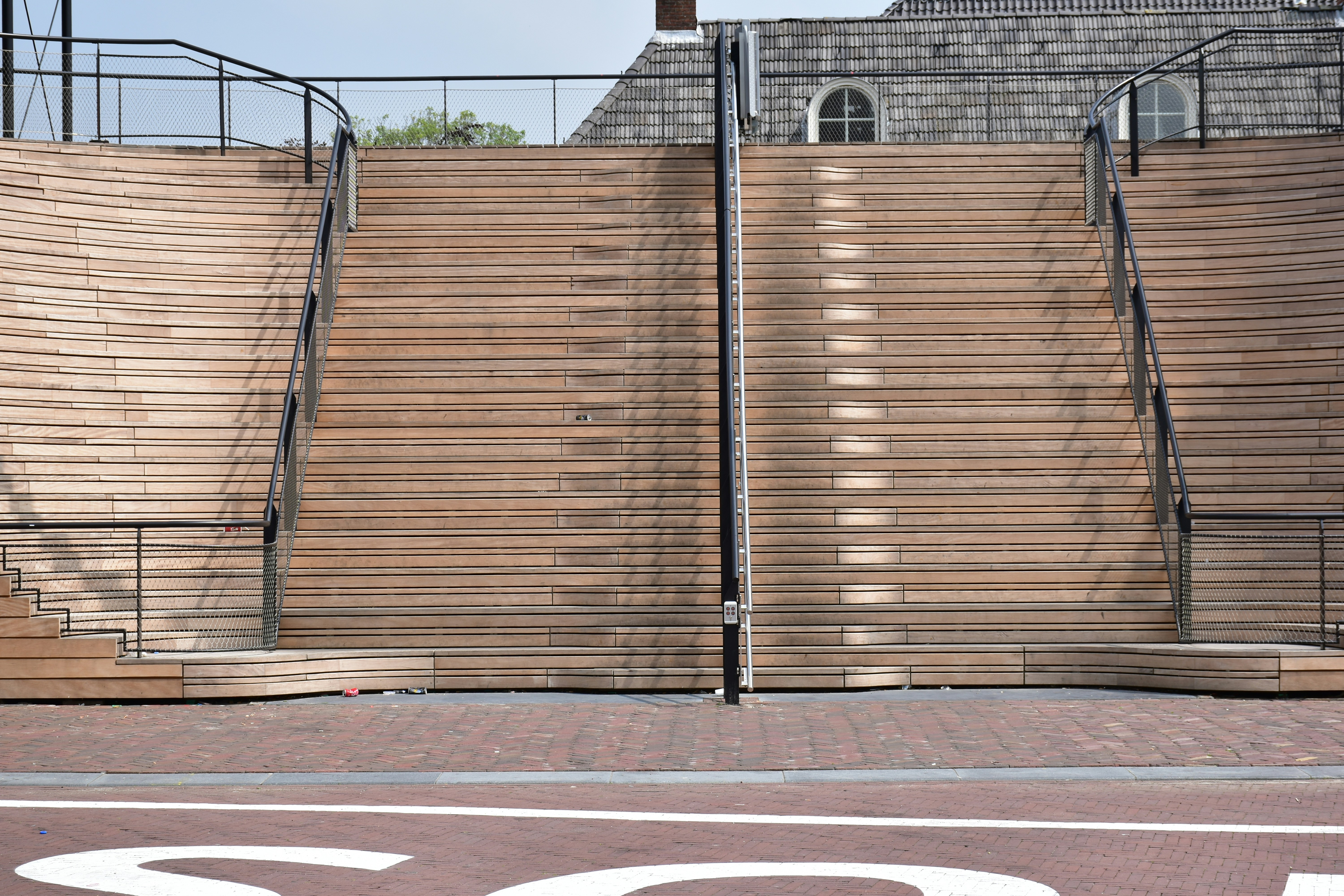 Symmetrical Brick Staircase Duo Framed by Railings