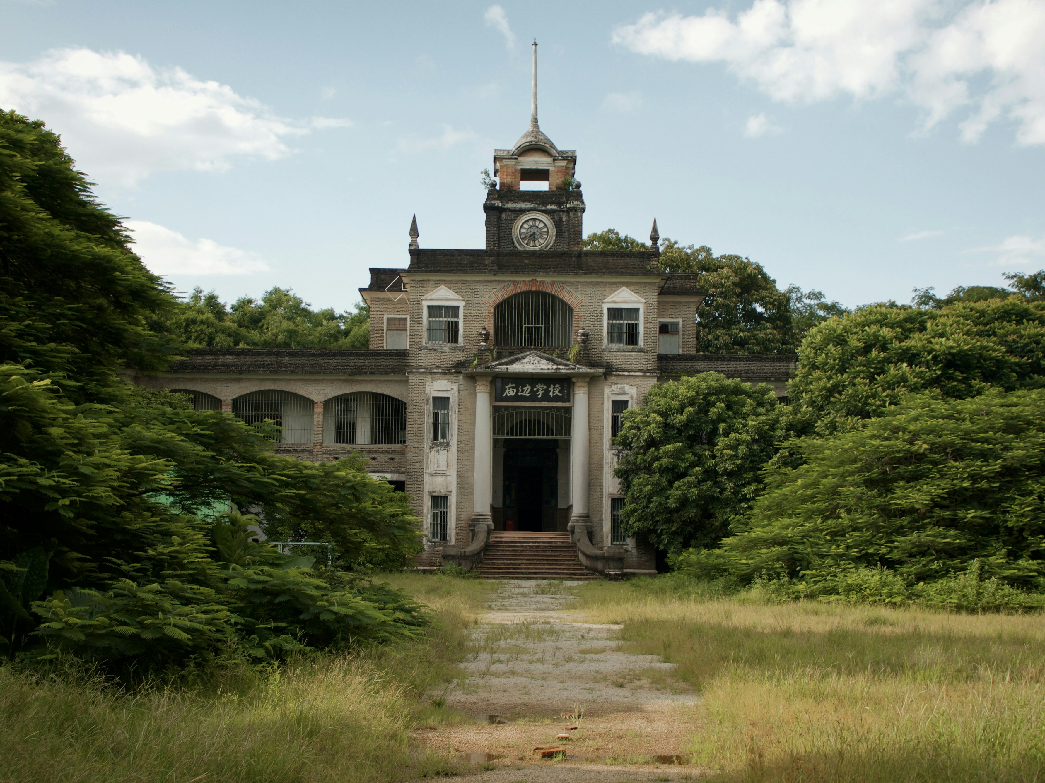Clocktower Gate amid Encroaching Greenery