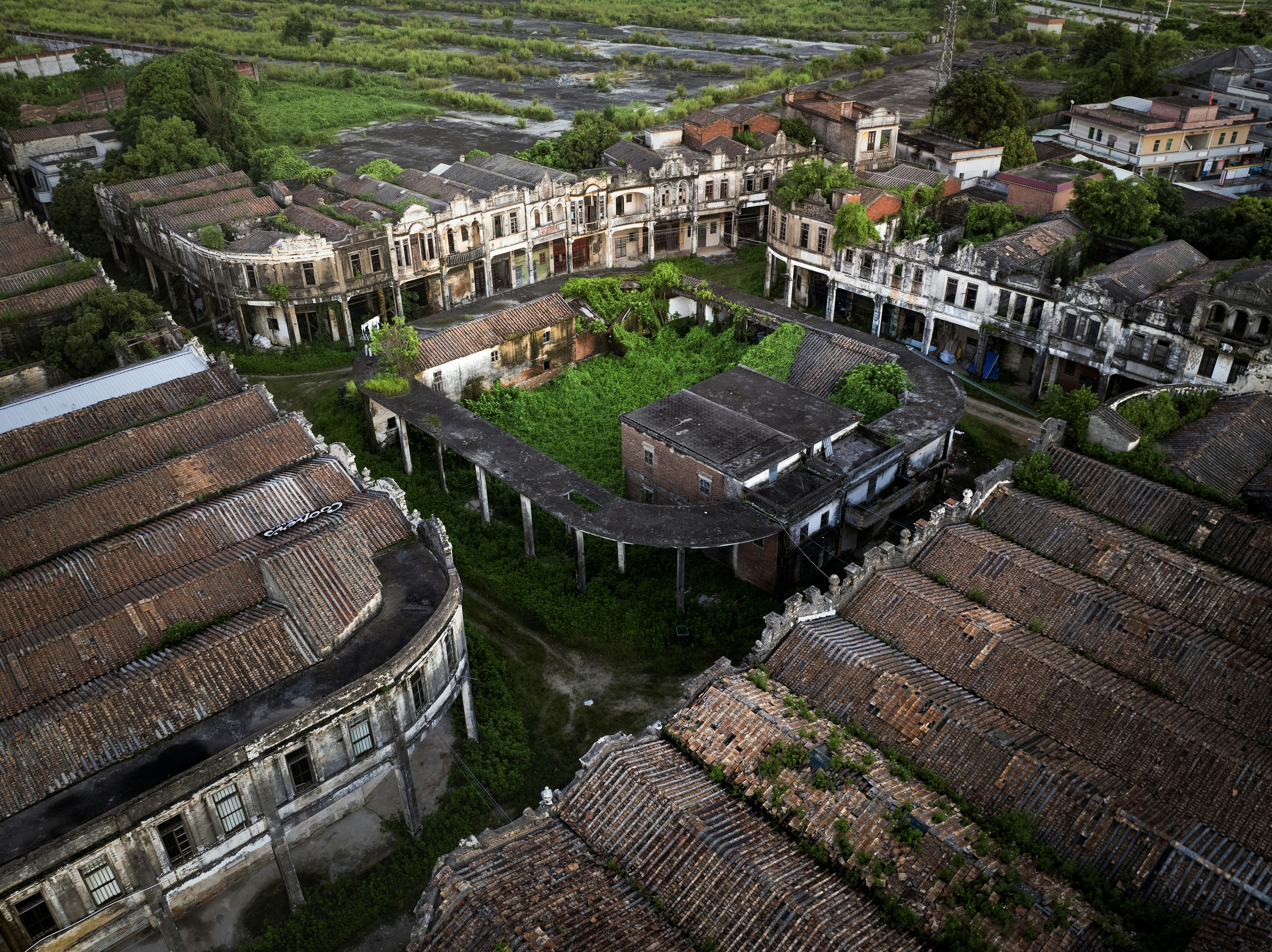 Timeworn Courtyards Framed by Tile-Roofed Arches