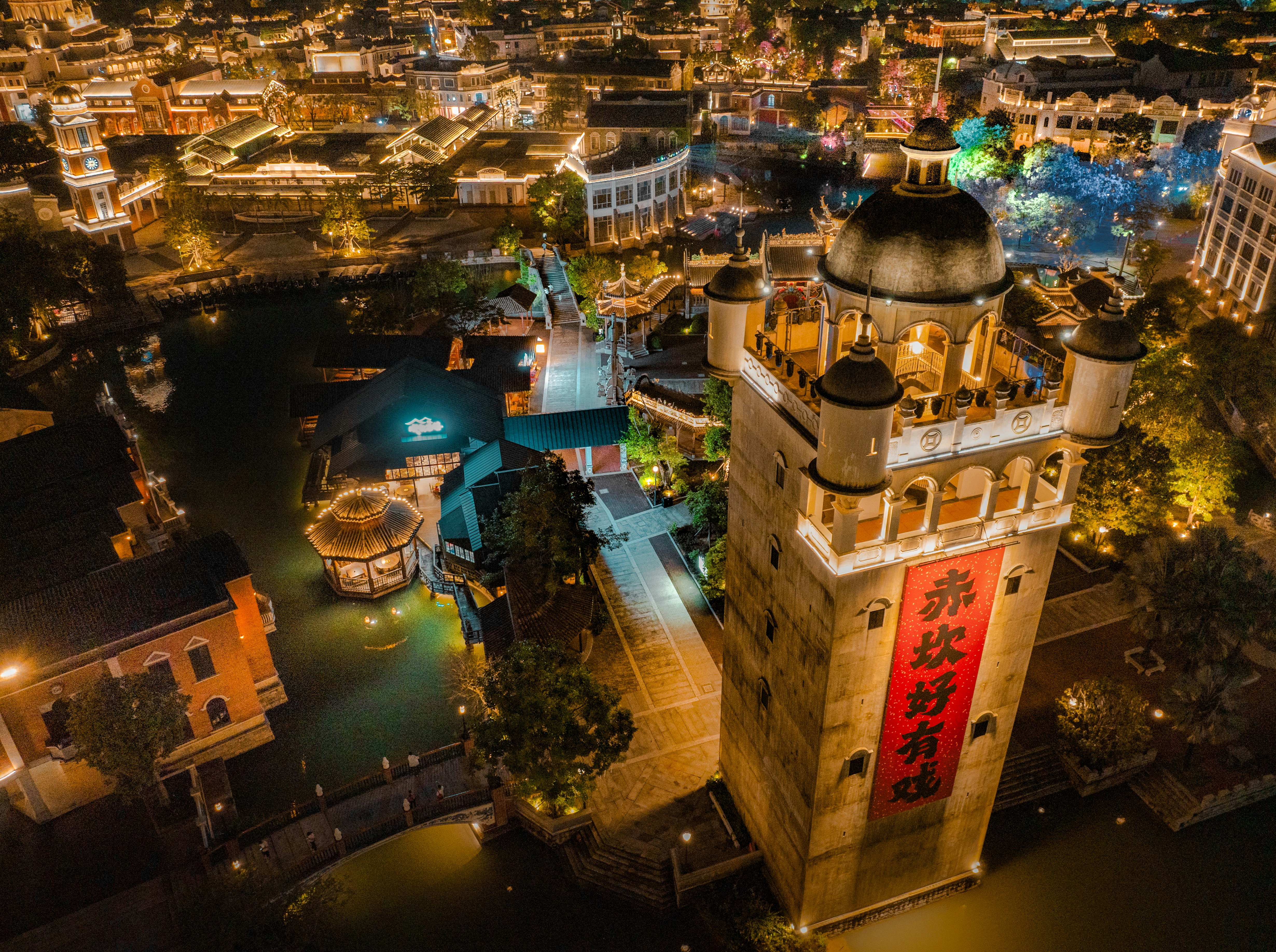 Riverside Lantern Tower at Night: A City Alight