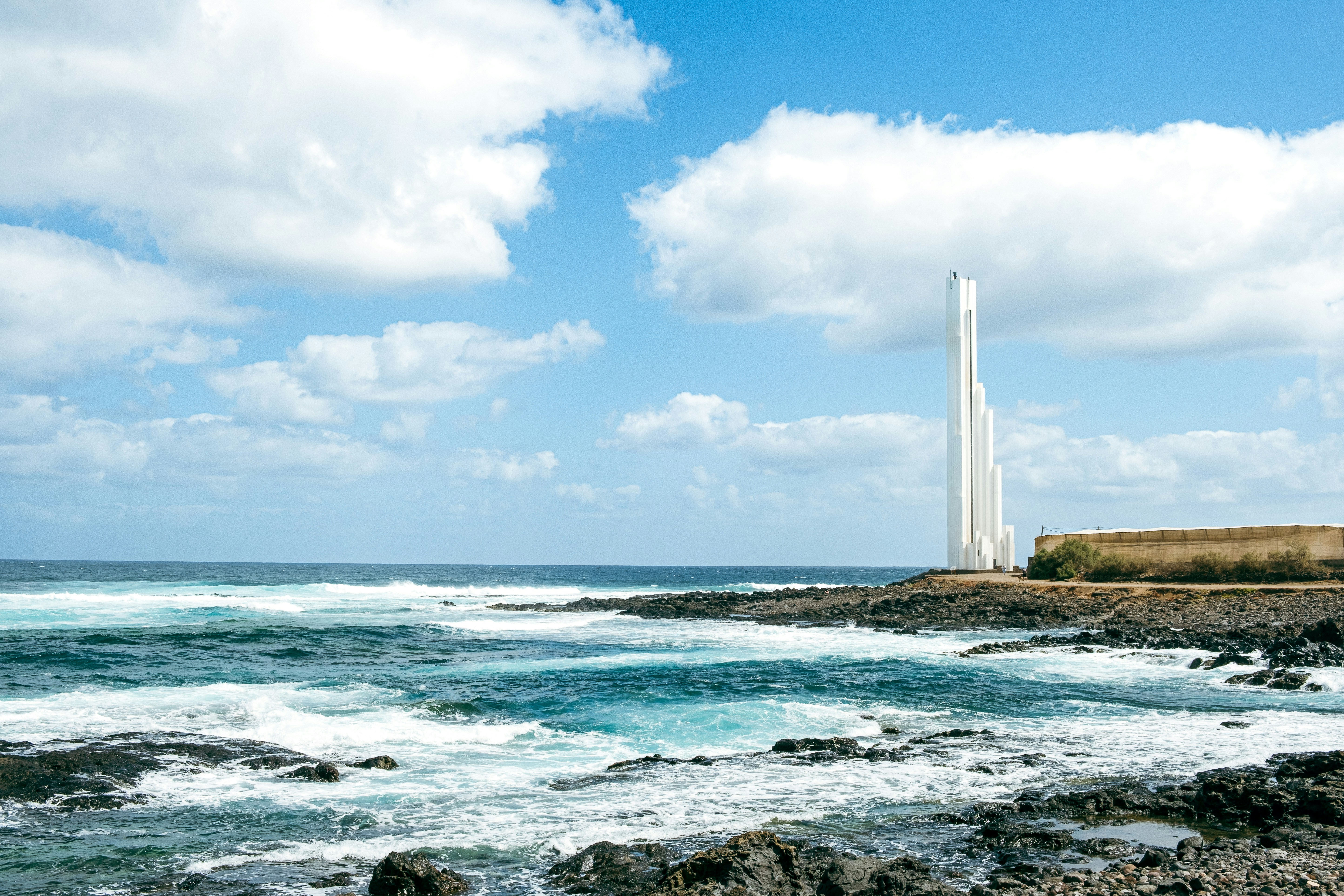 Azure Watch: The White Tower at the Edge of a Turquoise Coast