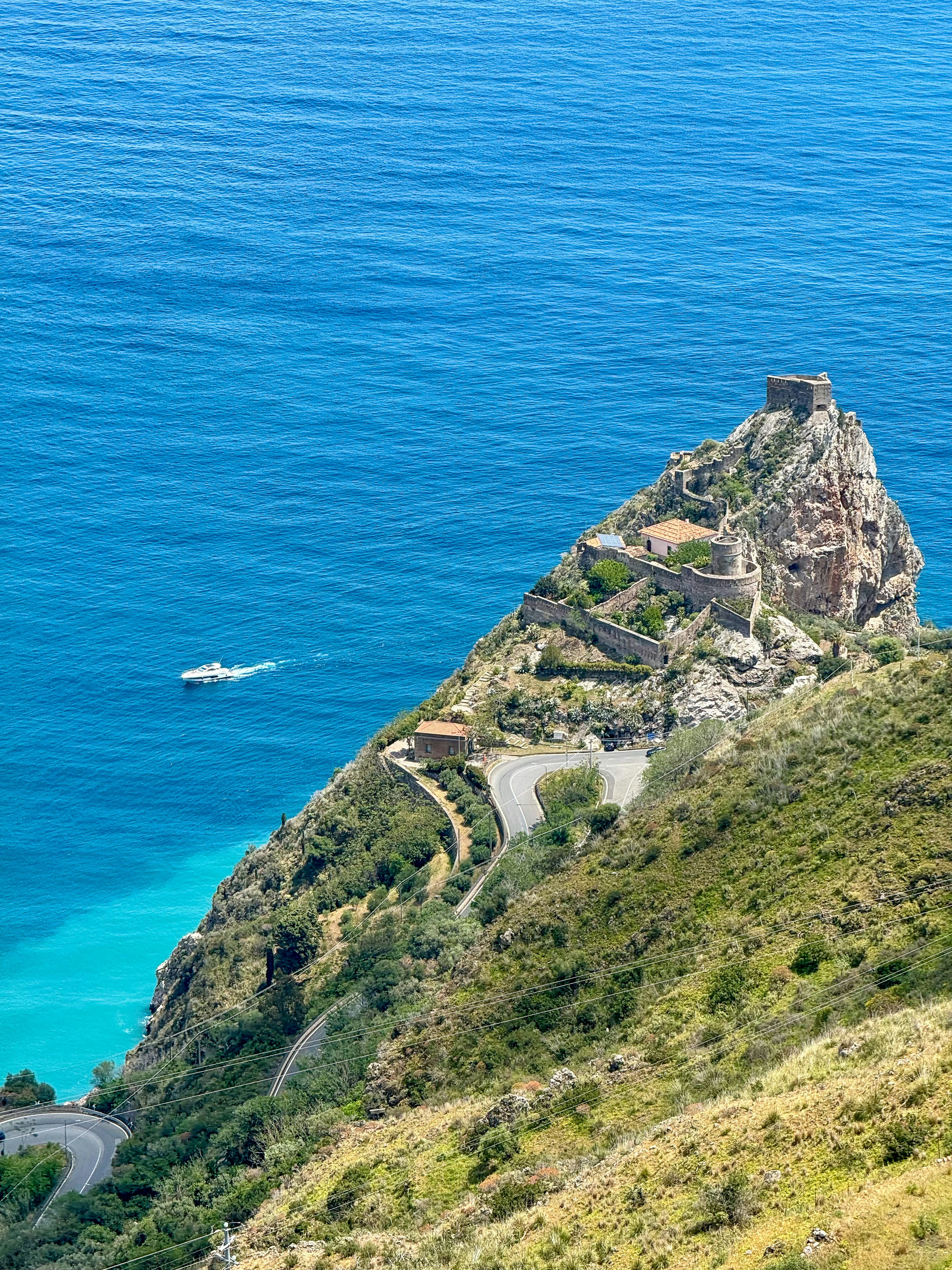 Clifftop Fortress and the Winding Road Above Turquoise Seas