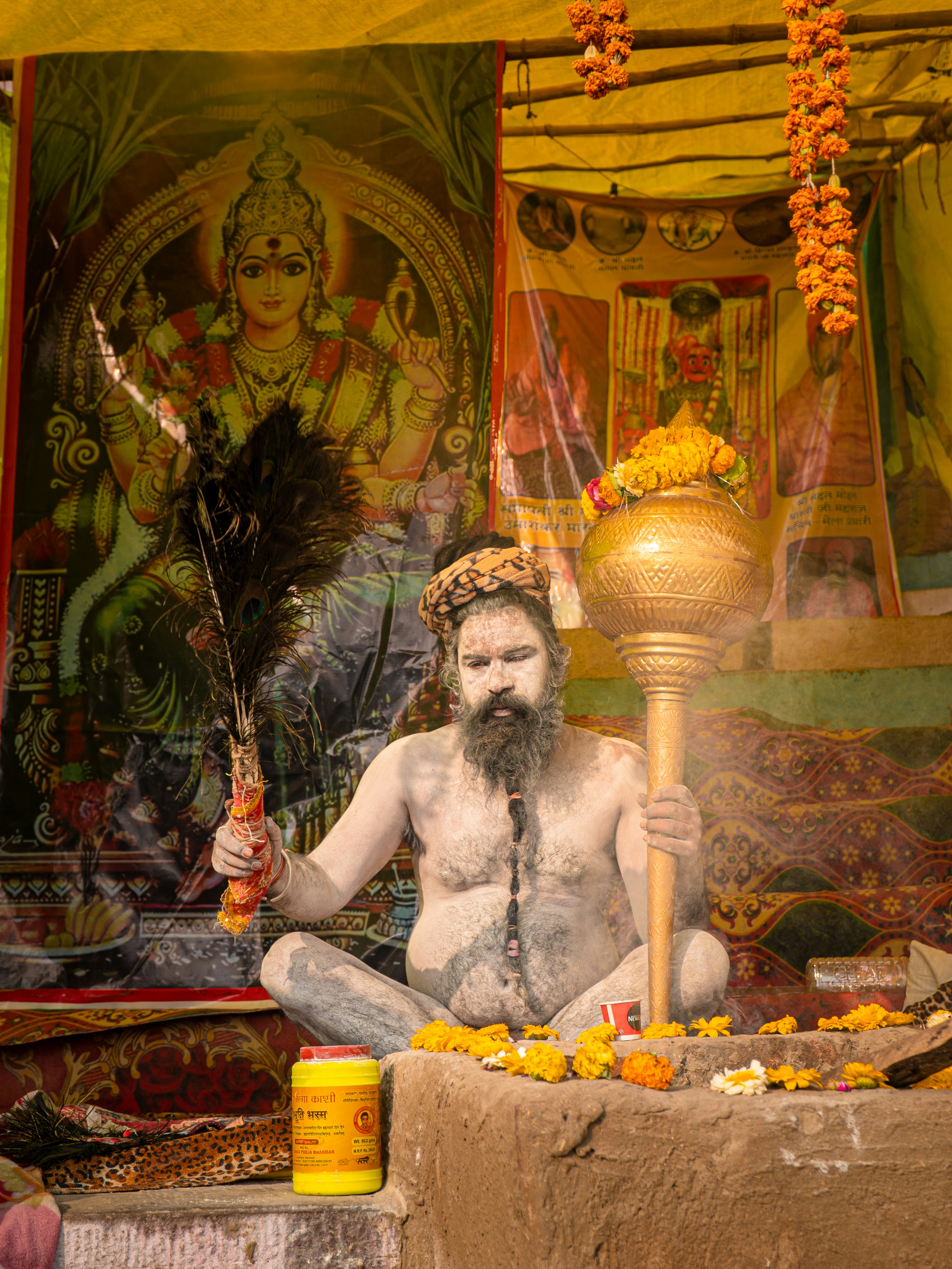 Bearded Ascetic in a Marigold-Decked Shrine, Grasping Feather Wand and Ceremonial Staff