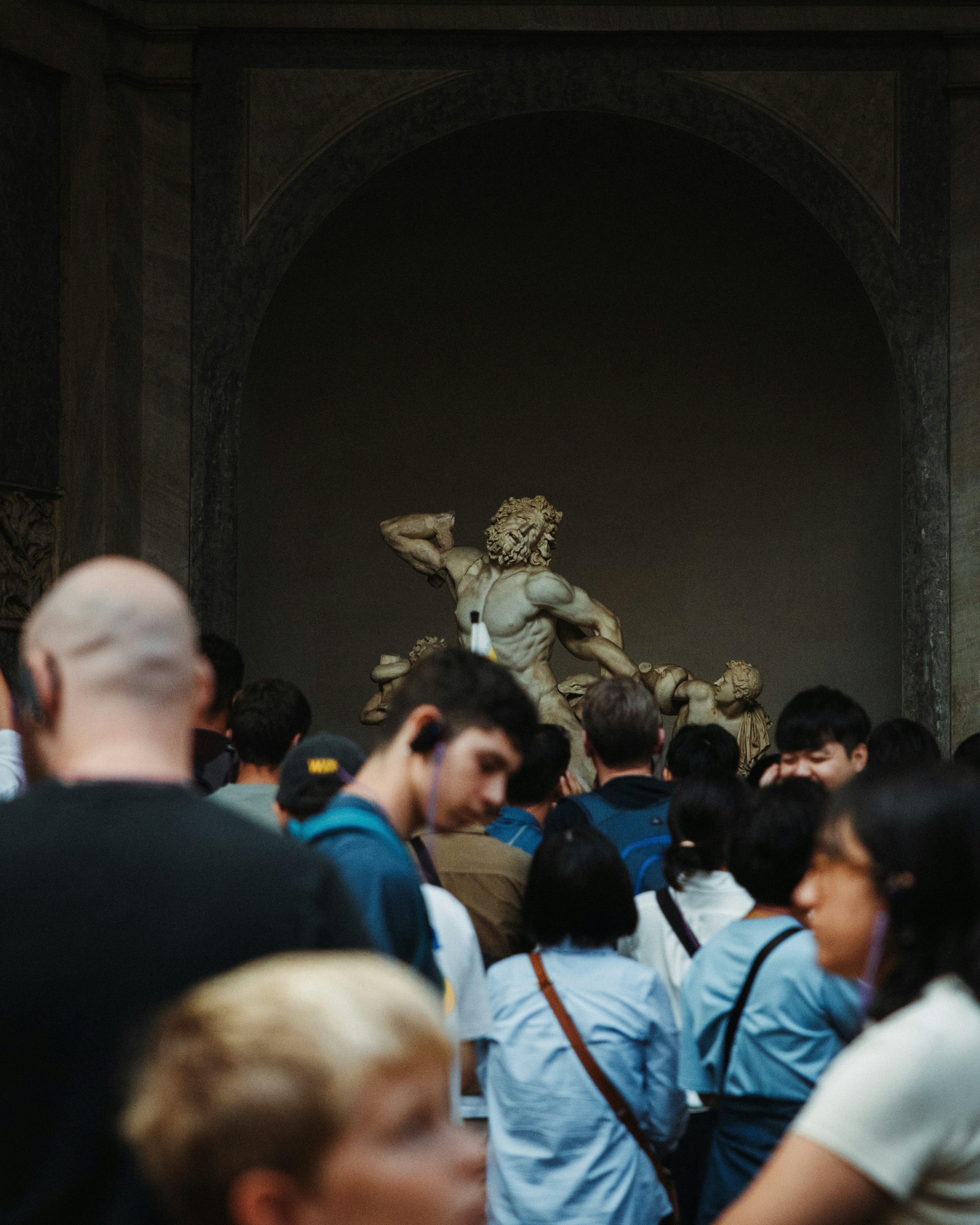 Sea of Visitors Before a Marble Sentinel