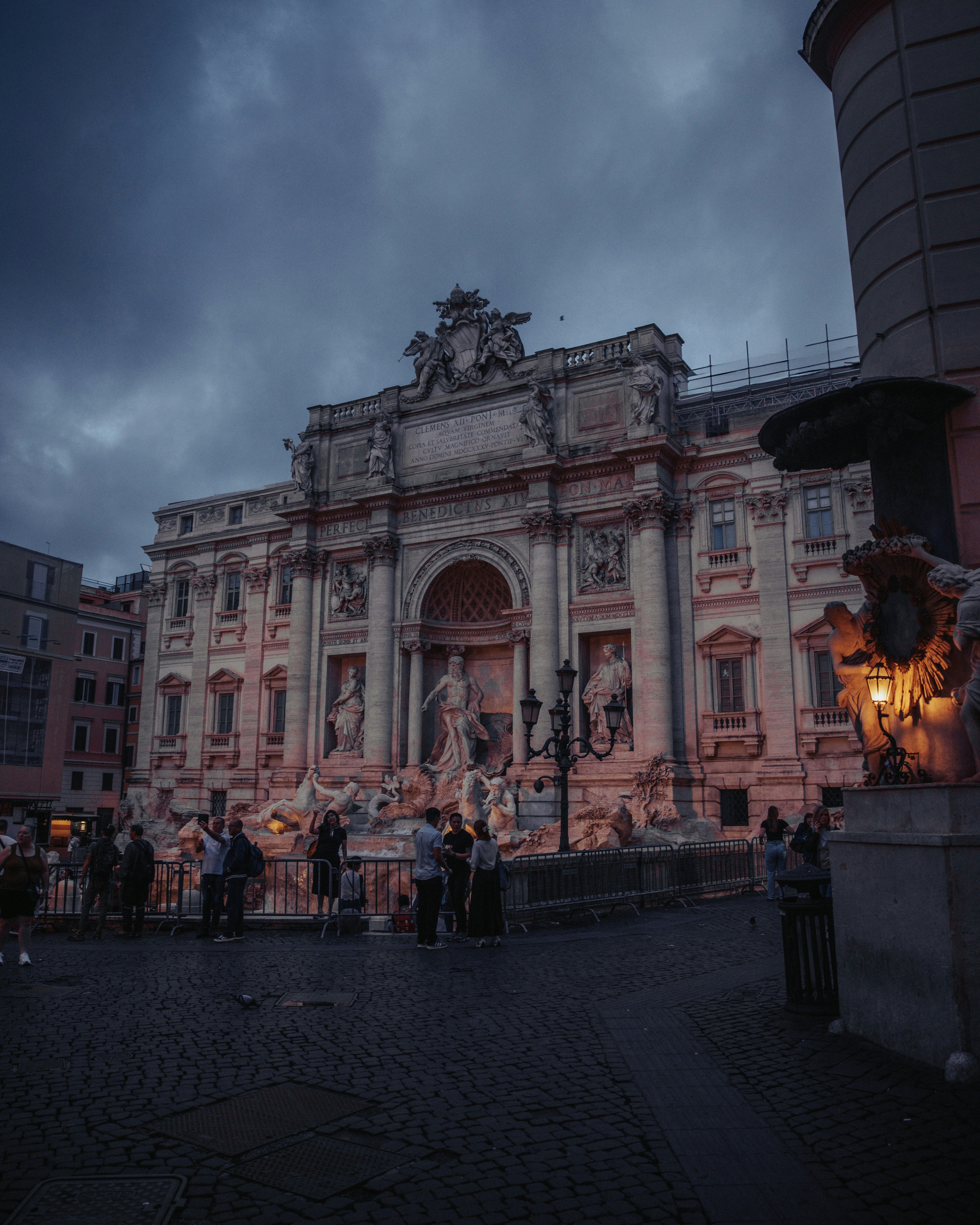 Dusk at the Grand Arch: Warm Lanterns Embrace a Baroque Facade