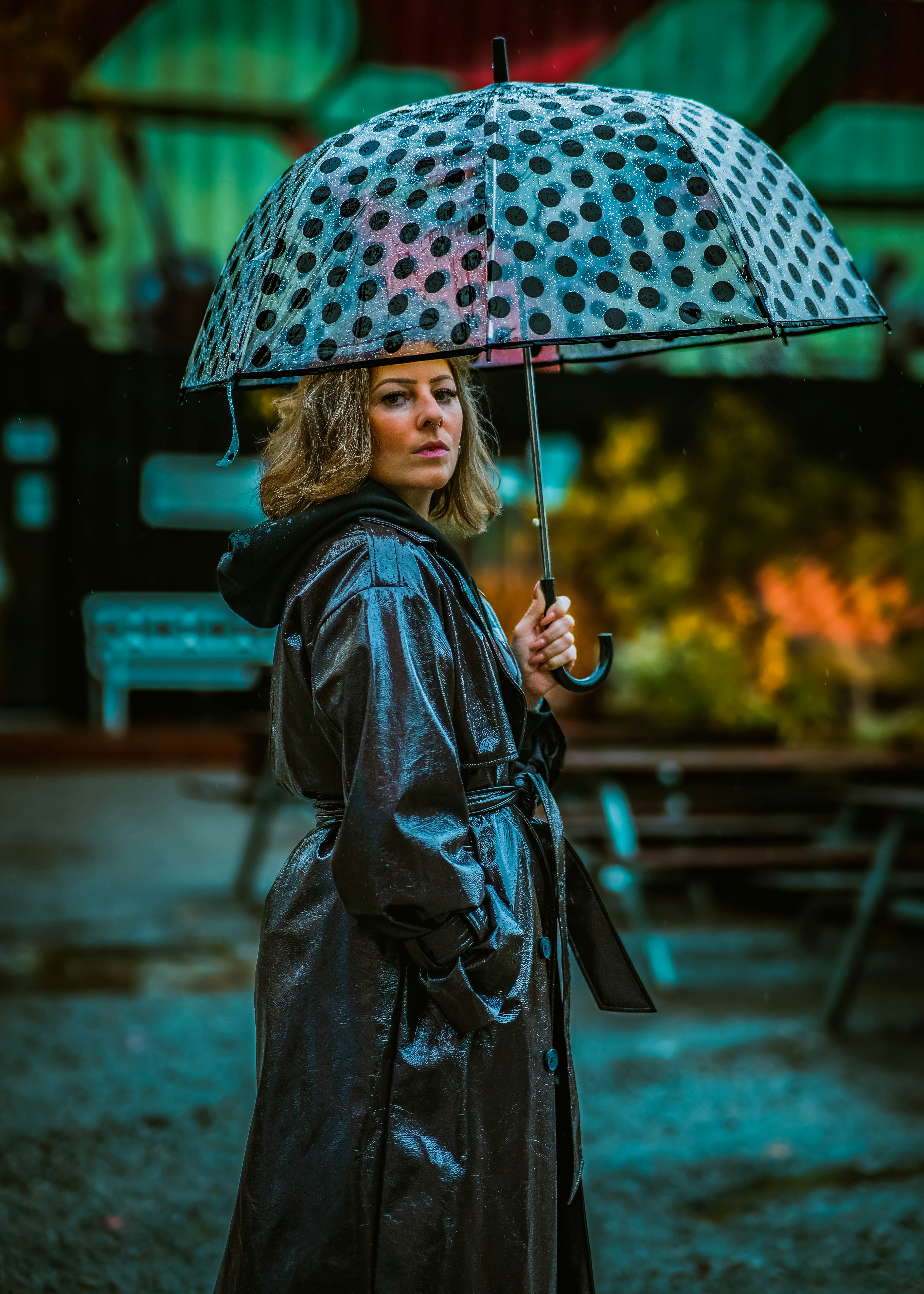 Polka-Dot Umbrella, Neon Rain: A Quiet Portrait Amid Neon Bokeh