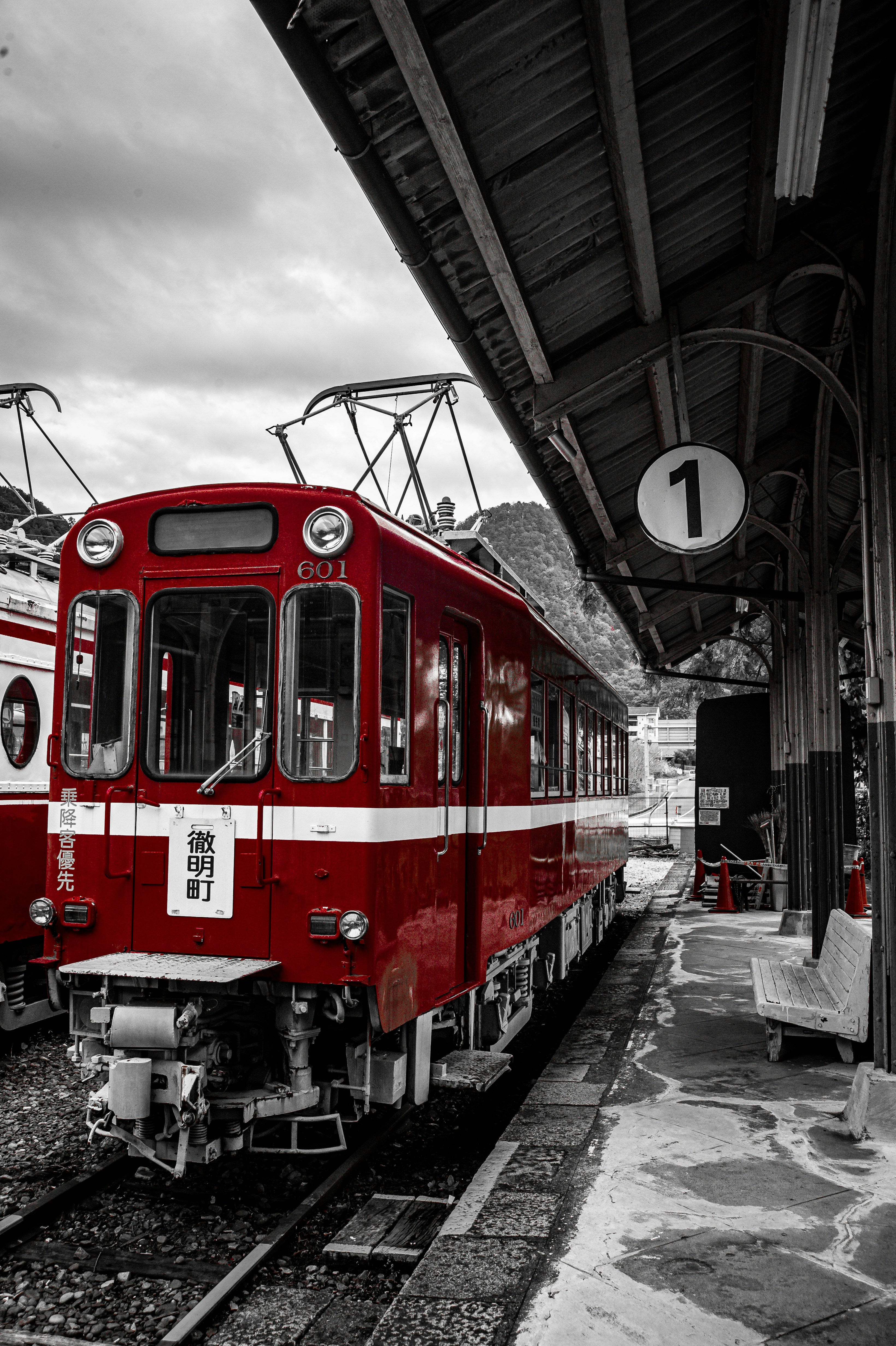 Crimson Locomotive at Platform 1: A Quiet, Selectively Colored Rail Moment