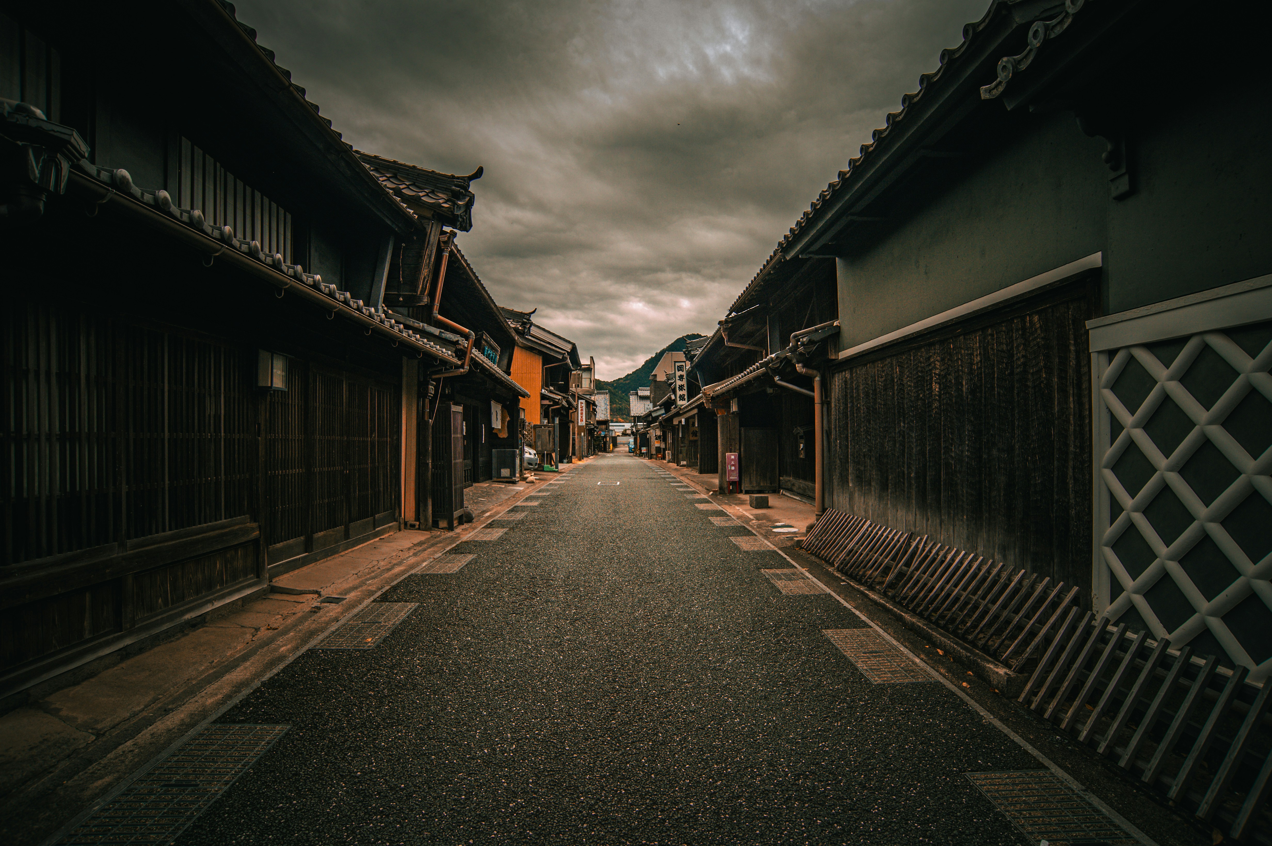 Toward the Vanishing Street: A Moody Alley Between Timbered Facades