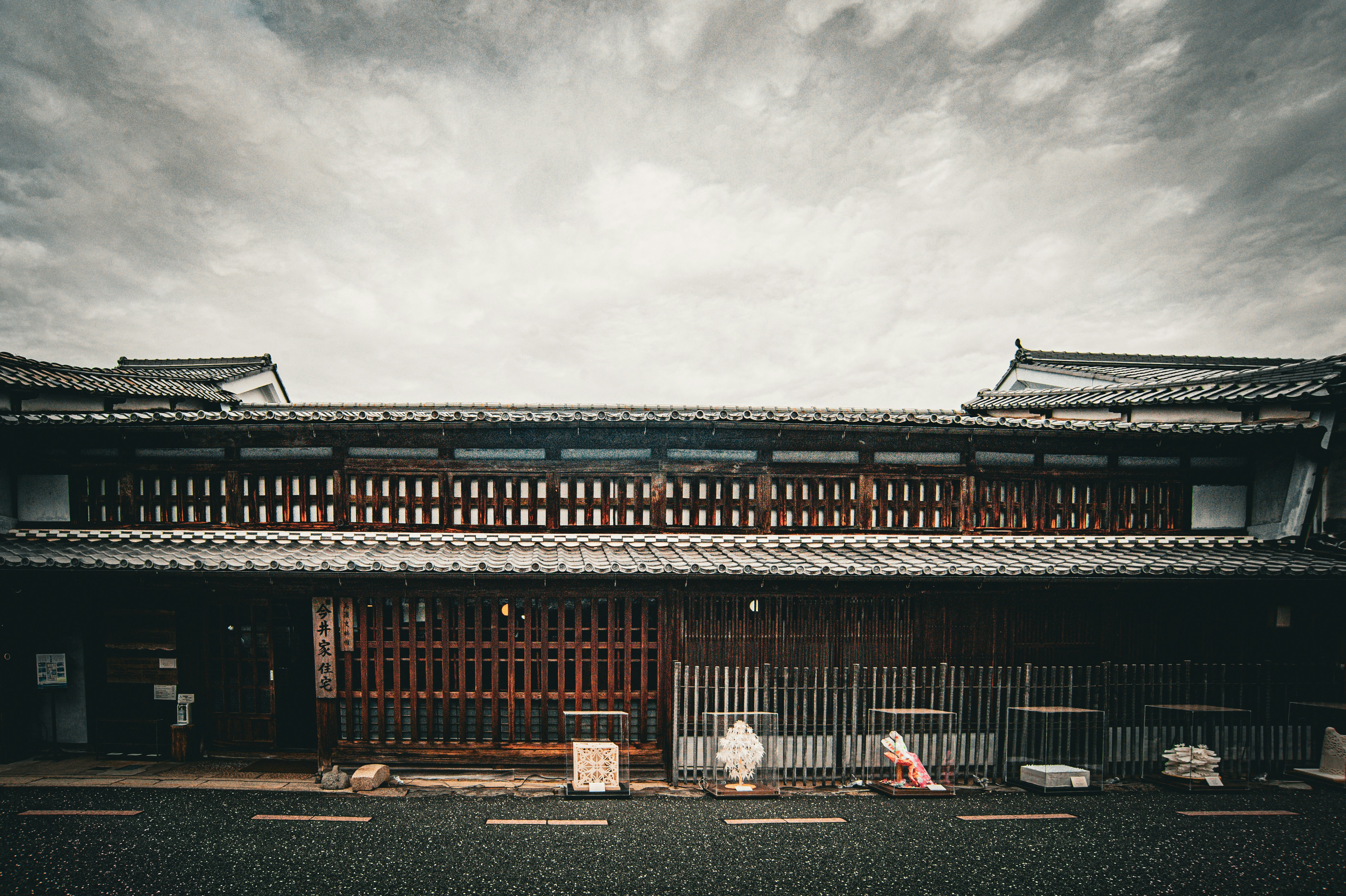 Red Lattice Facade Beneath a Cloudy Japanese Sky