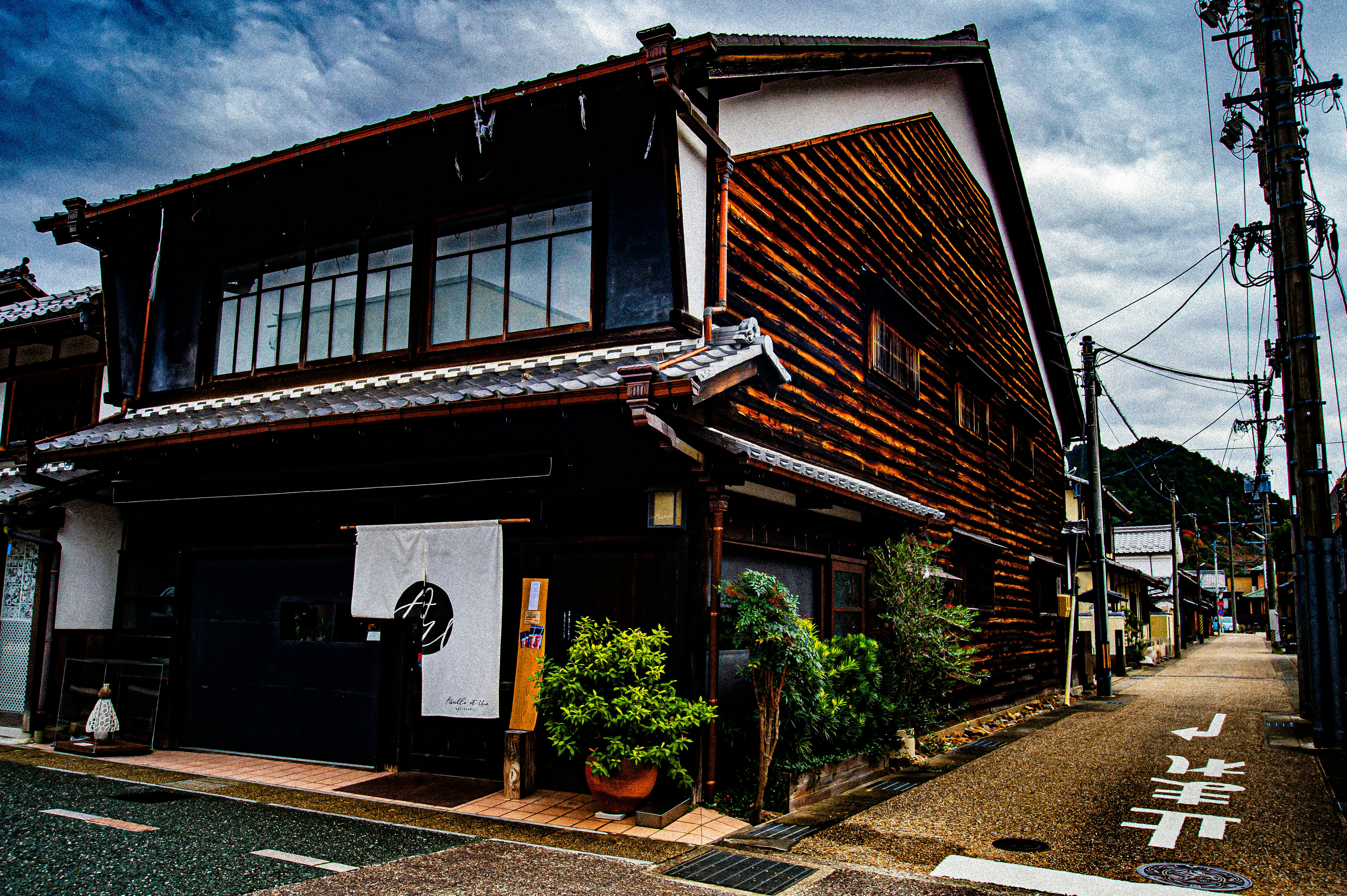 Rain-Worn Timber Facade on a Quiet Japanese Street Corner