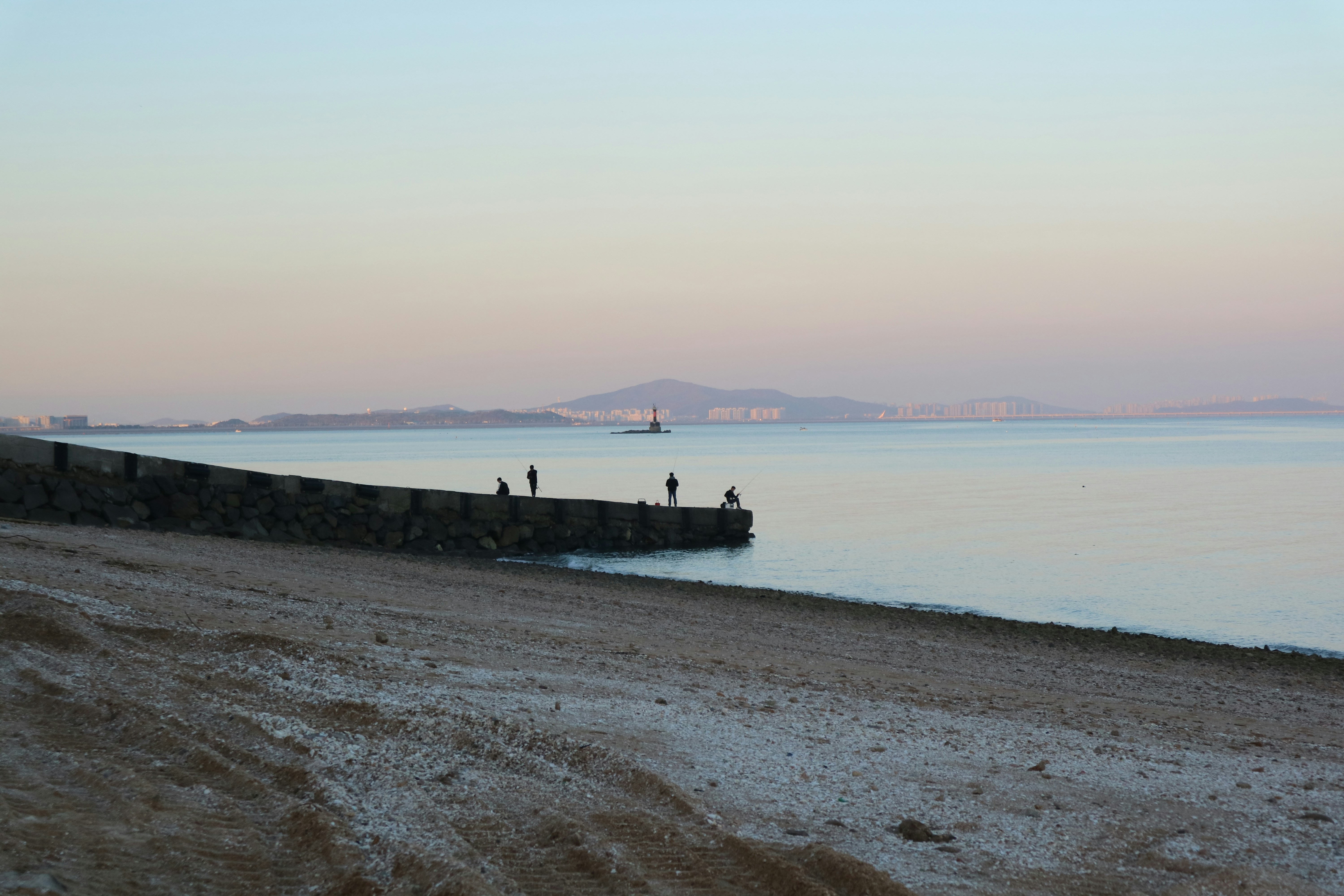 Dusk on the Jetty: Silhouettes and Quiet Sea