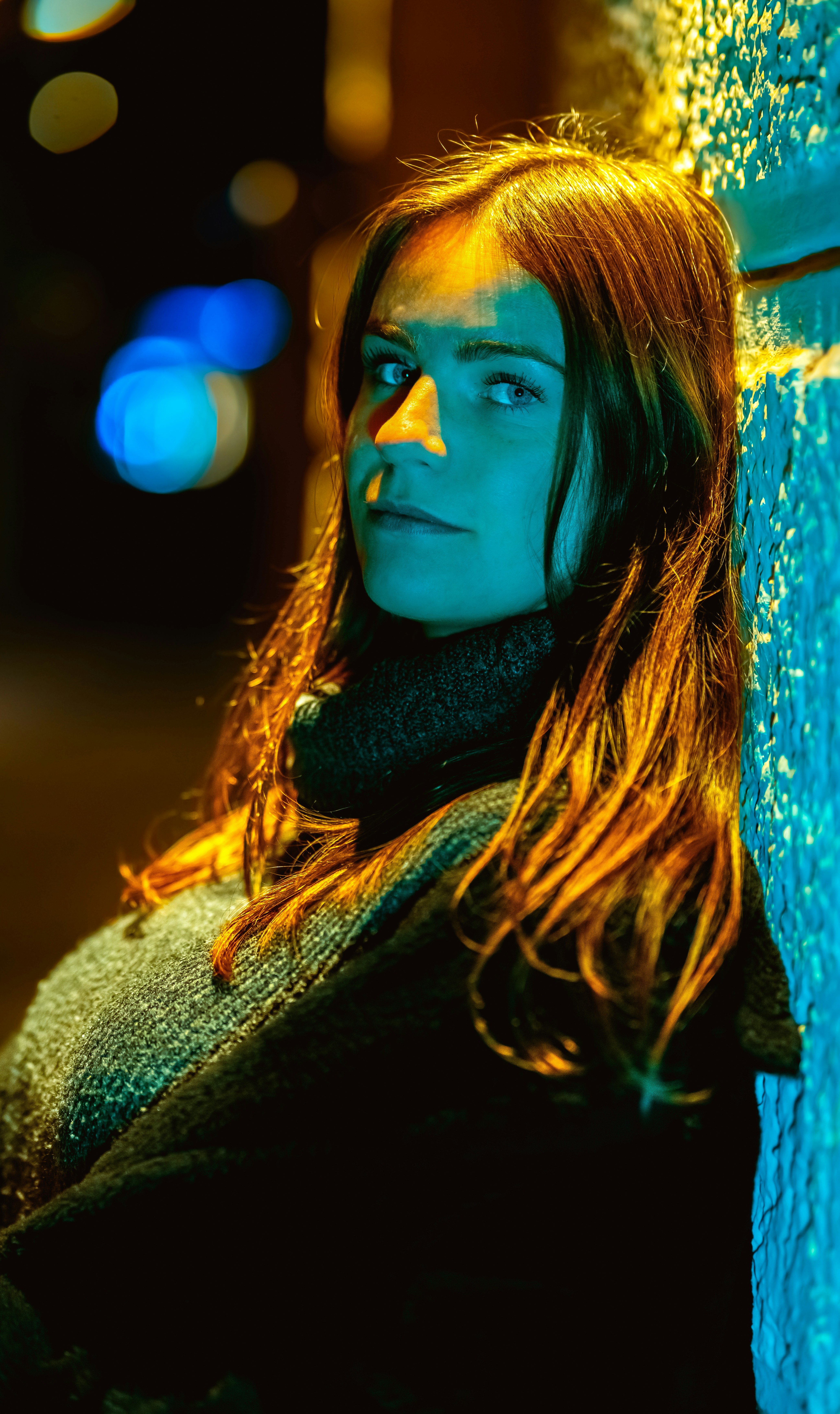 Neon Velvet Portrait by a Quiet Blue Wall