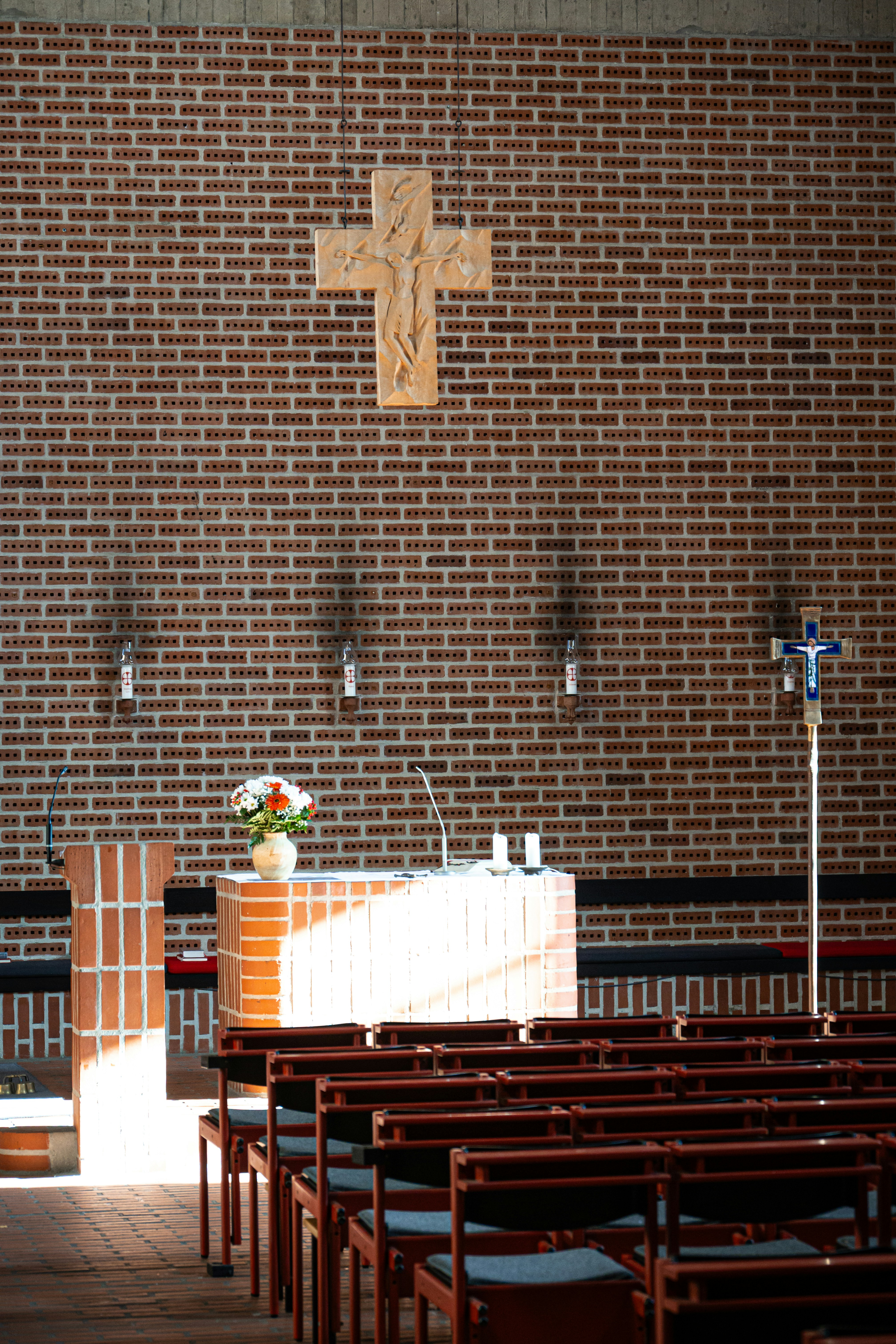 Center Cross in a Brick Chapel: Dappled Light on the Altar