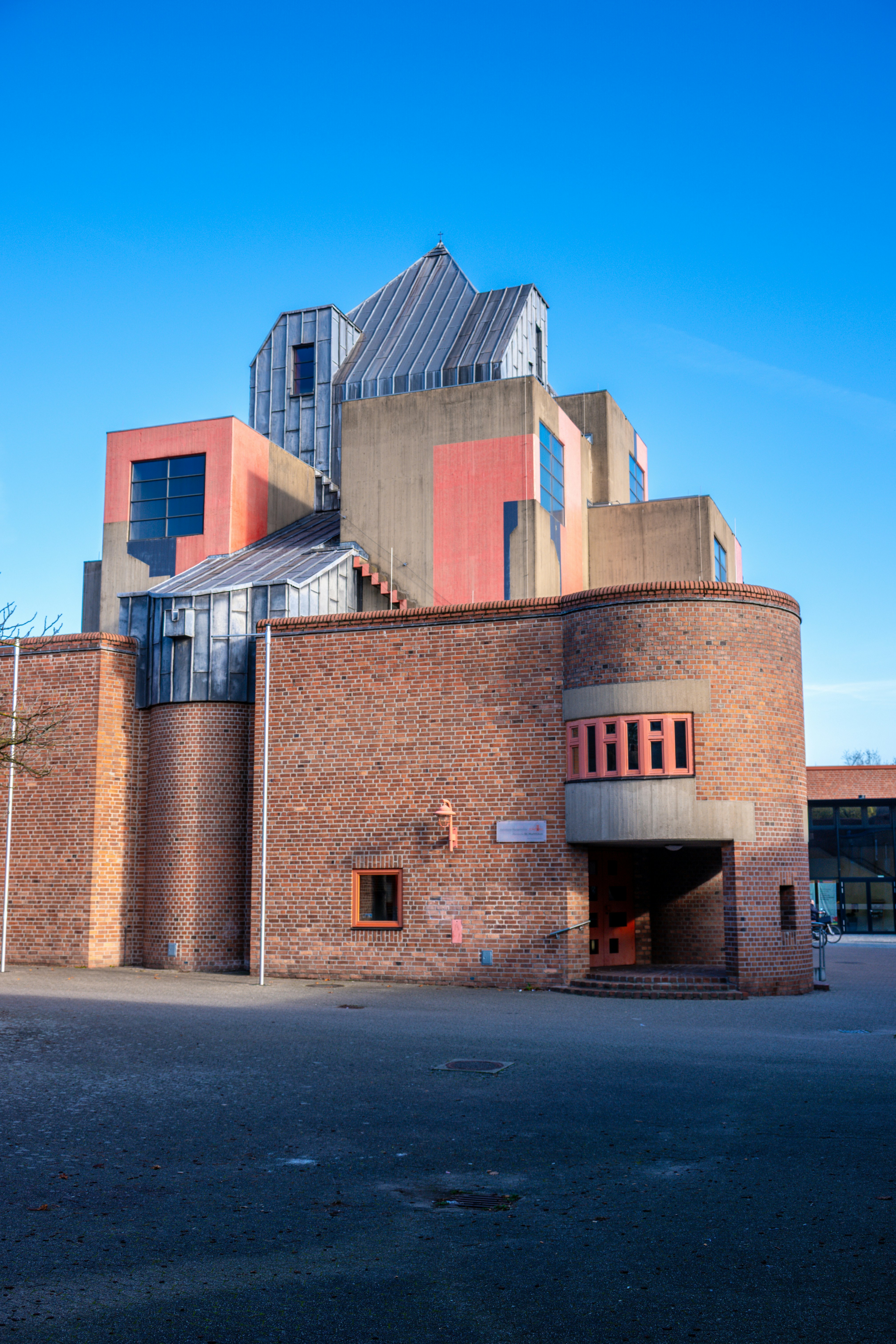 Modern building with eclectic architectural design and brick facade ...