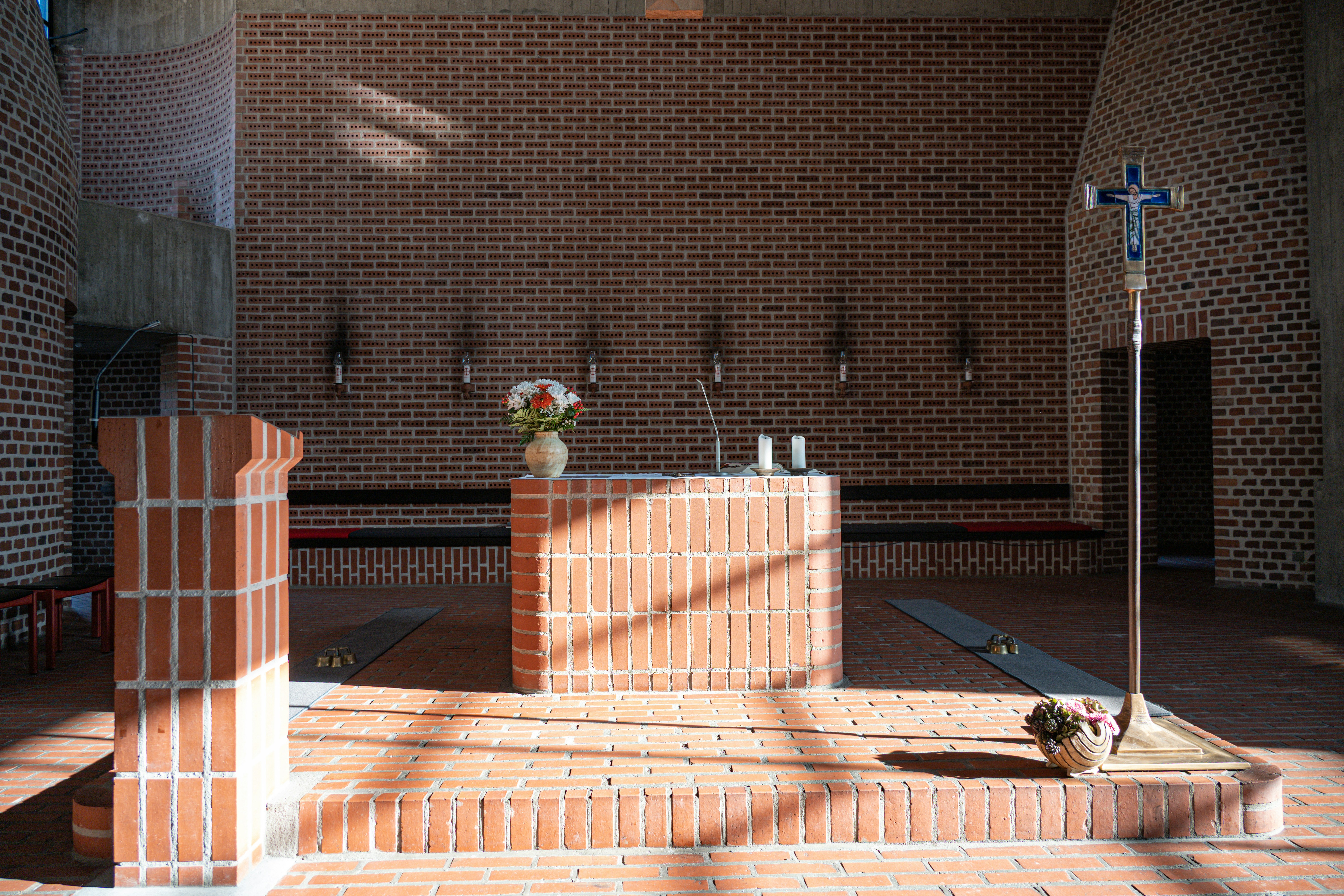 Sunlit Brick Chapel: Vase on the Quiet Altar