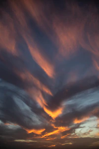 Ember Veins Unfold Over a Quiet Dusk Sky