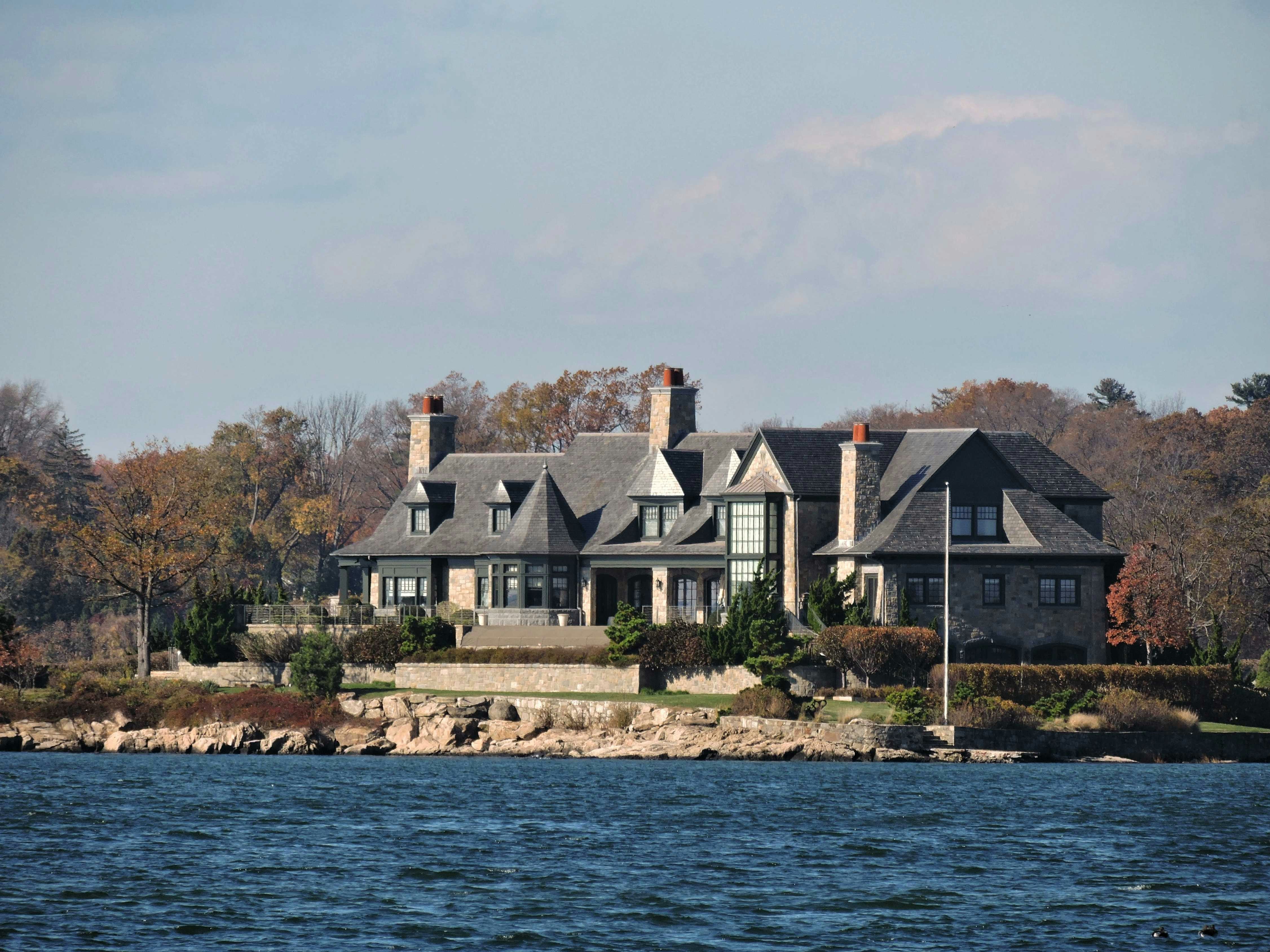 Large stone house on the water's edge photo – Free Outdoor Image on ...