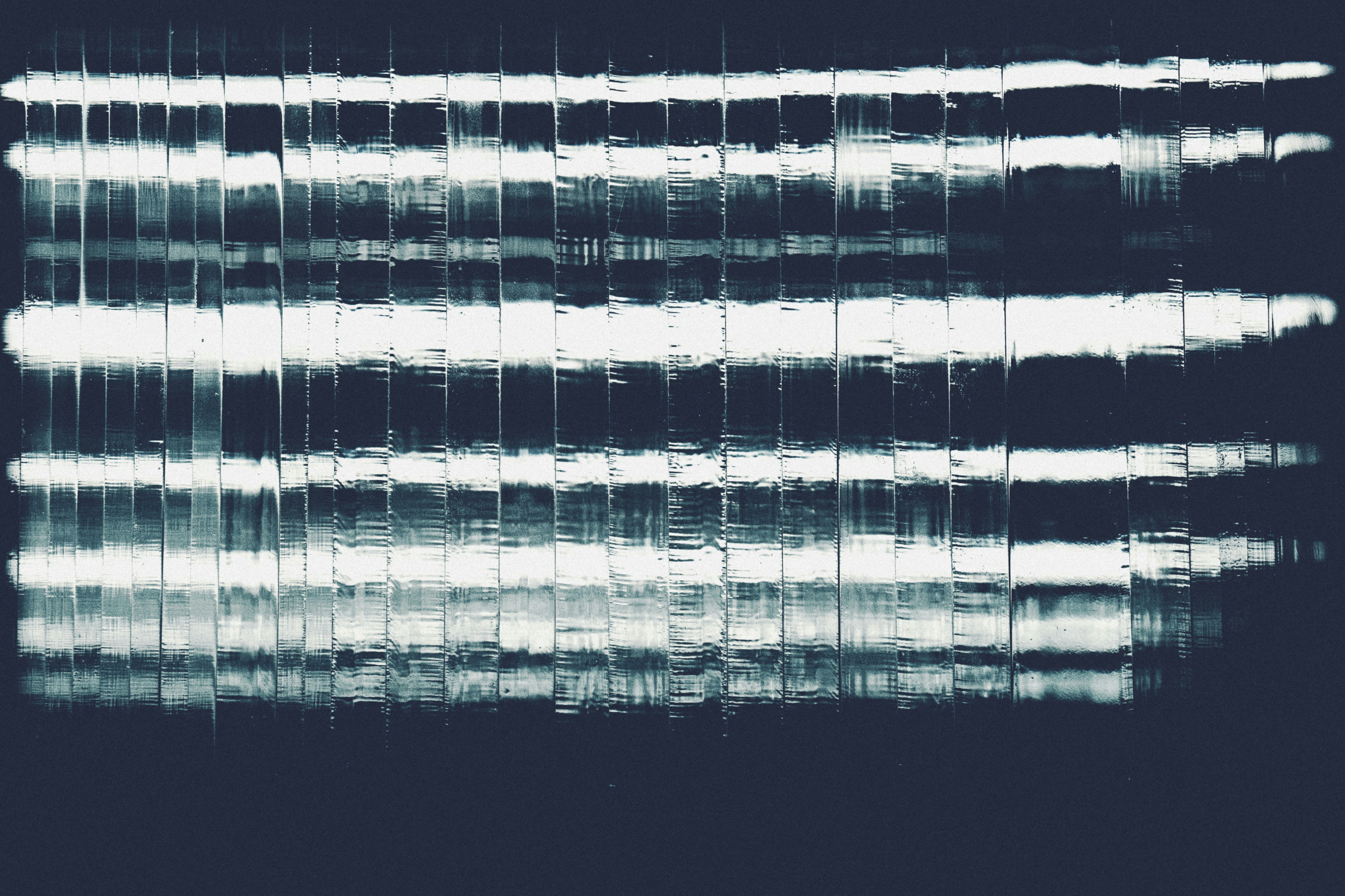Cyan Spectral Stripes: a spectrogram-like tapestry across a dark frame