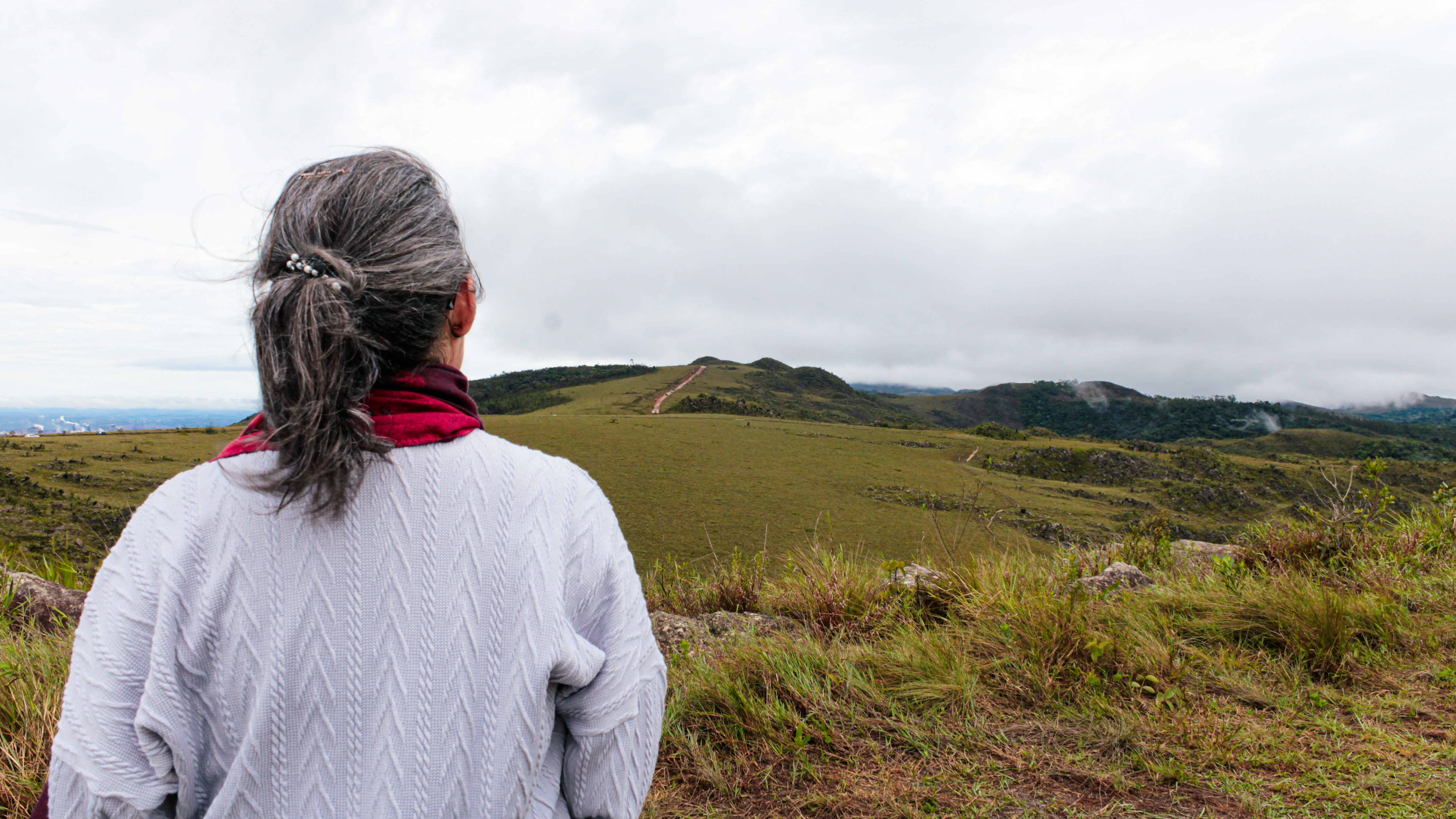 Toward the Ridge: A lone figure on a windswept moor