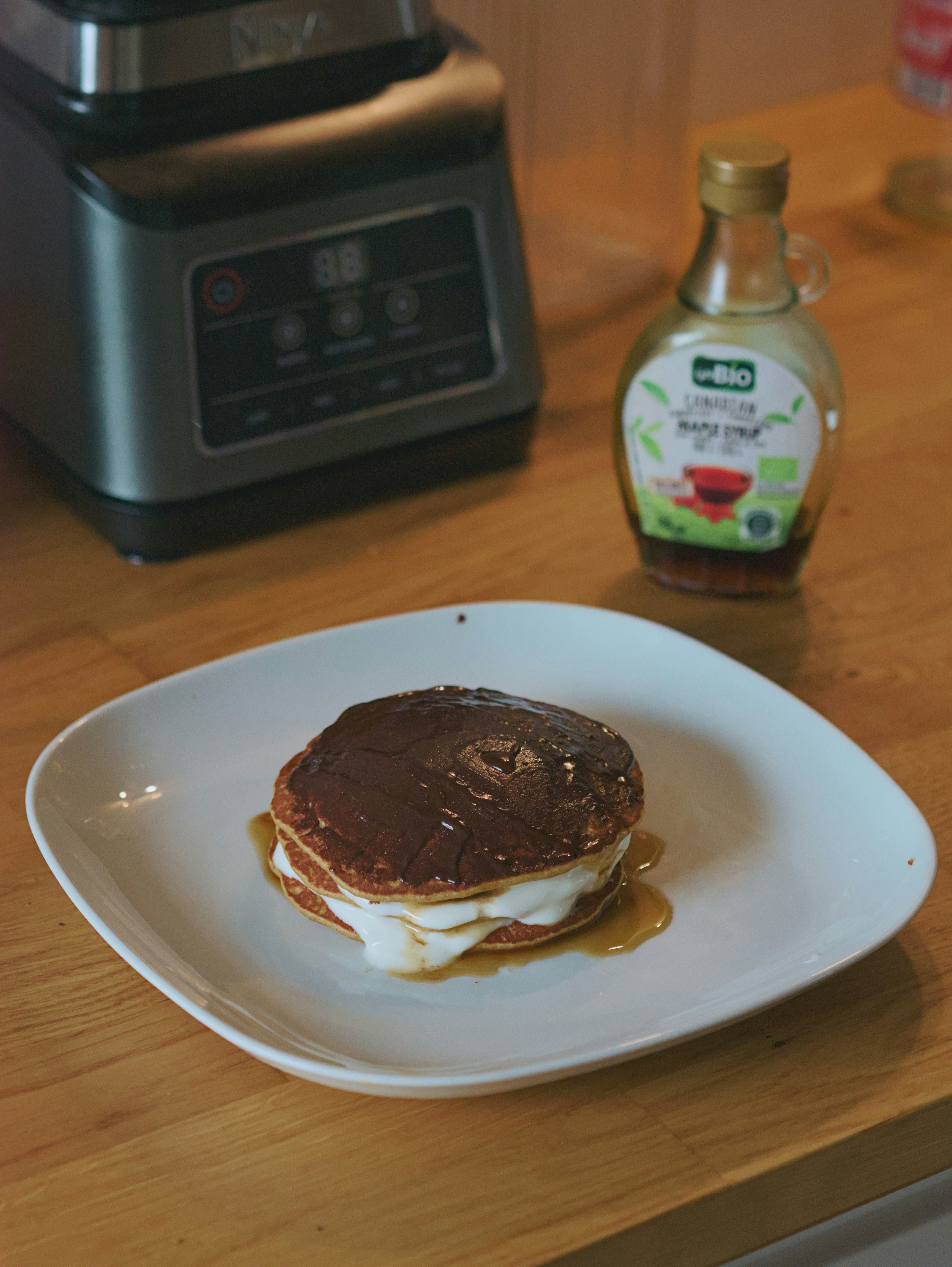 Chocolate-glazed Cream Sandwich on a Warm Kitchen Plate