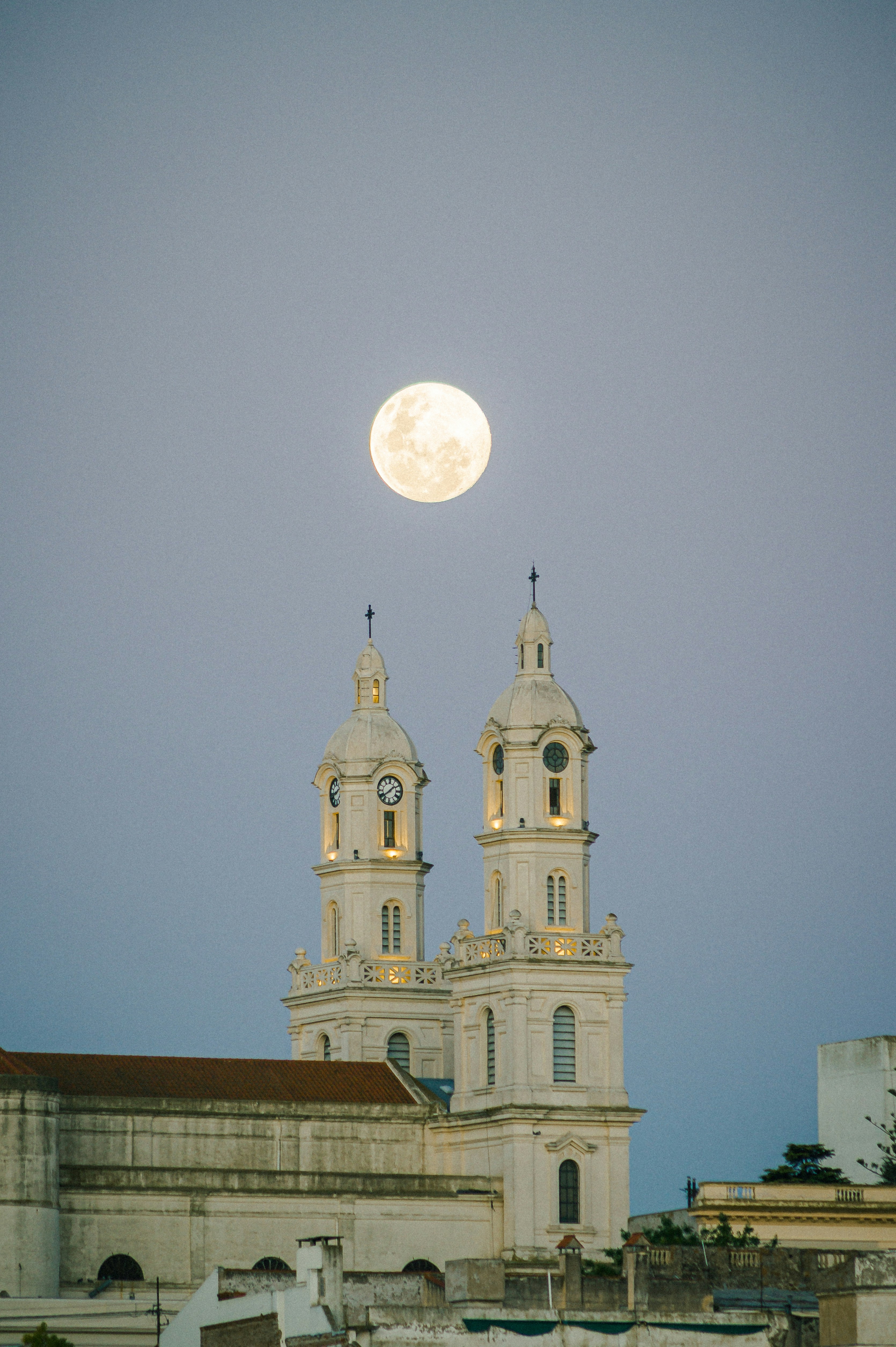 Moon Over Twin Spires: A Quiet Dusk over a Colonial Church