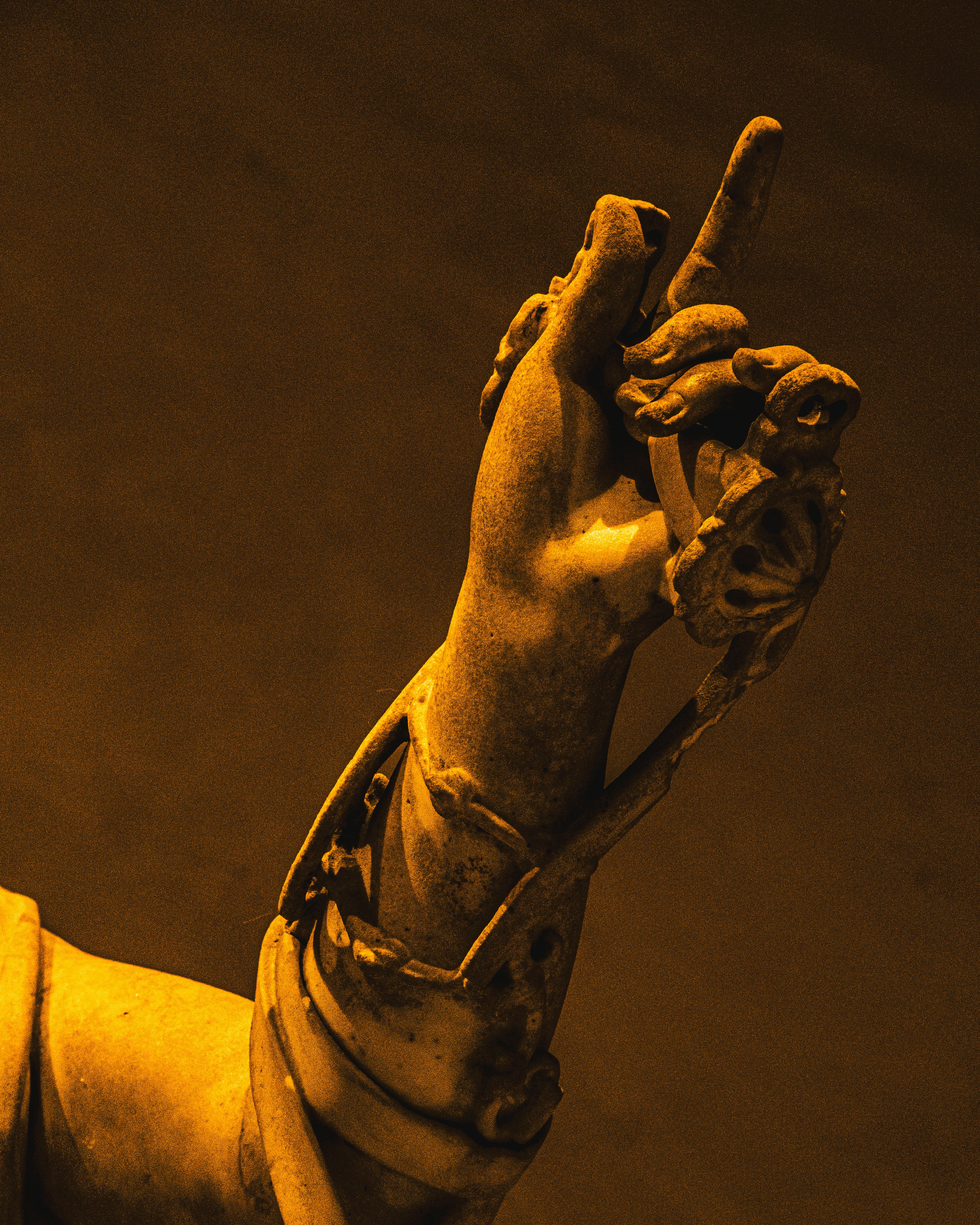 The Amber Grasp: A Chained Hand Sculpted in Warm Night Light