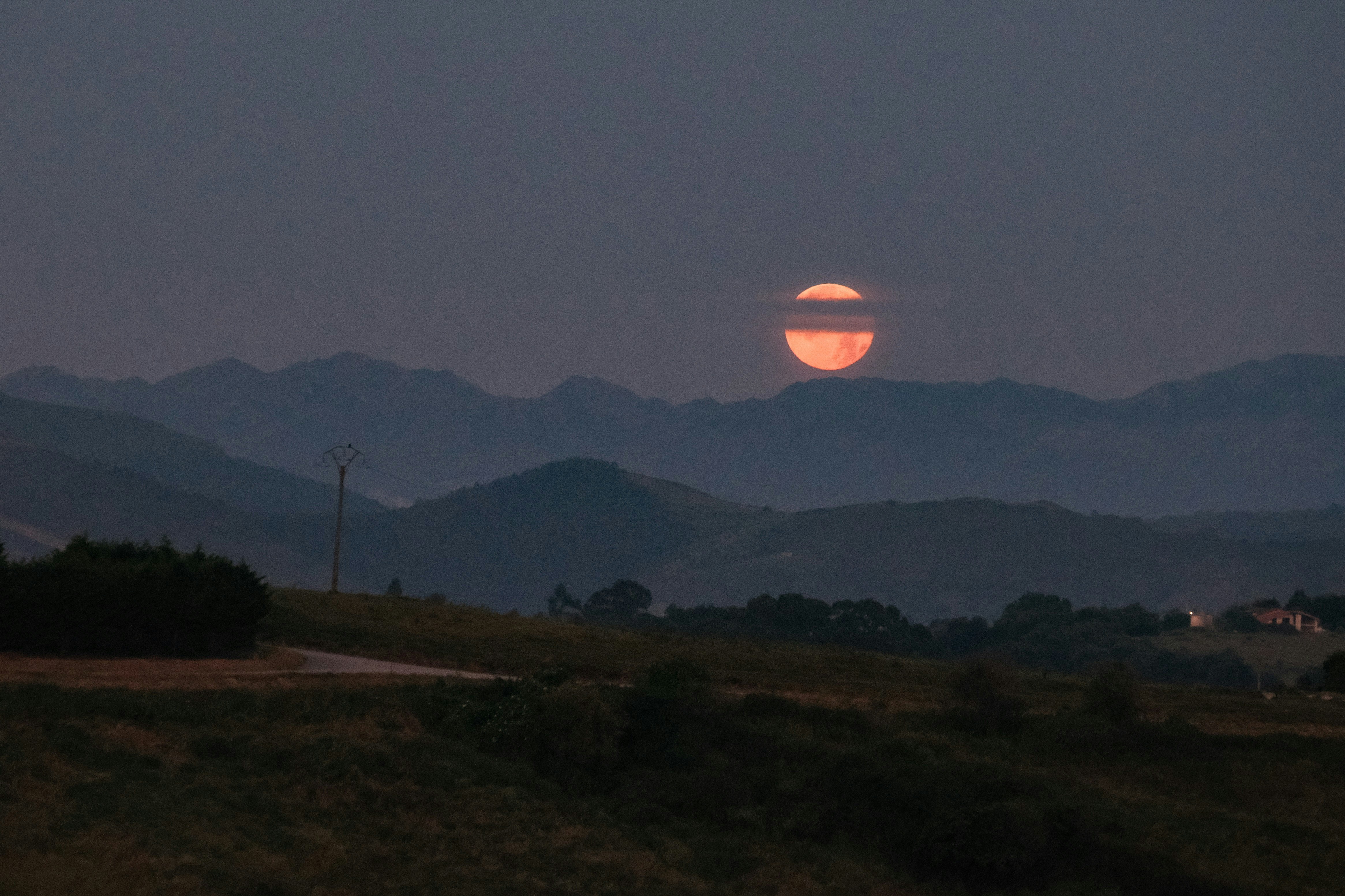 Horizon Ember: The Pale Sun Halved by Veiled Peaks
