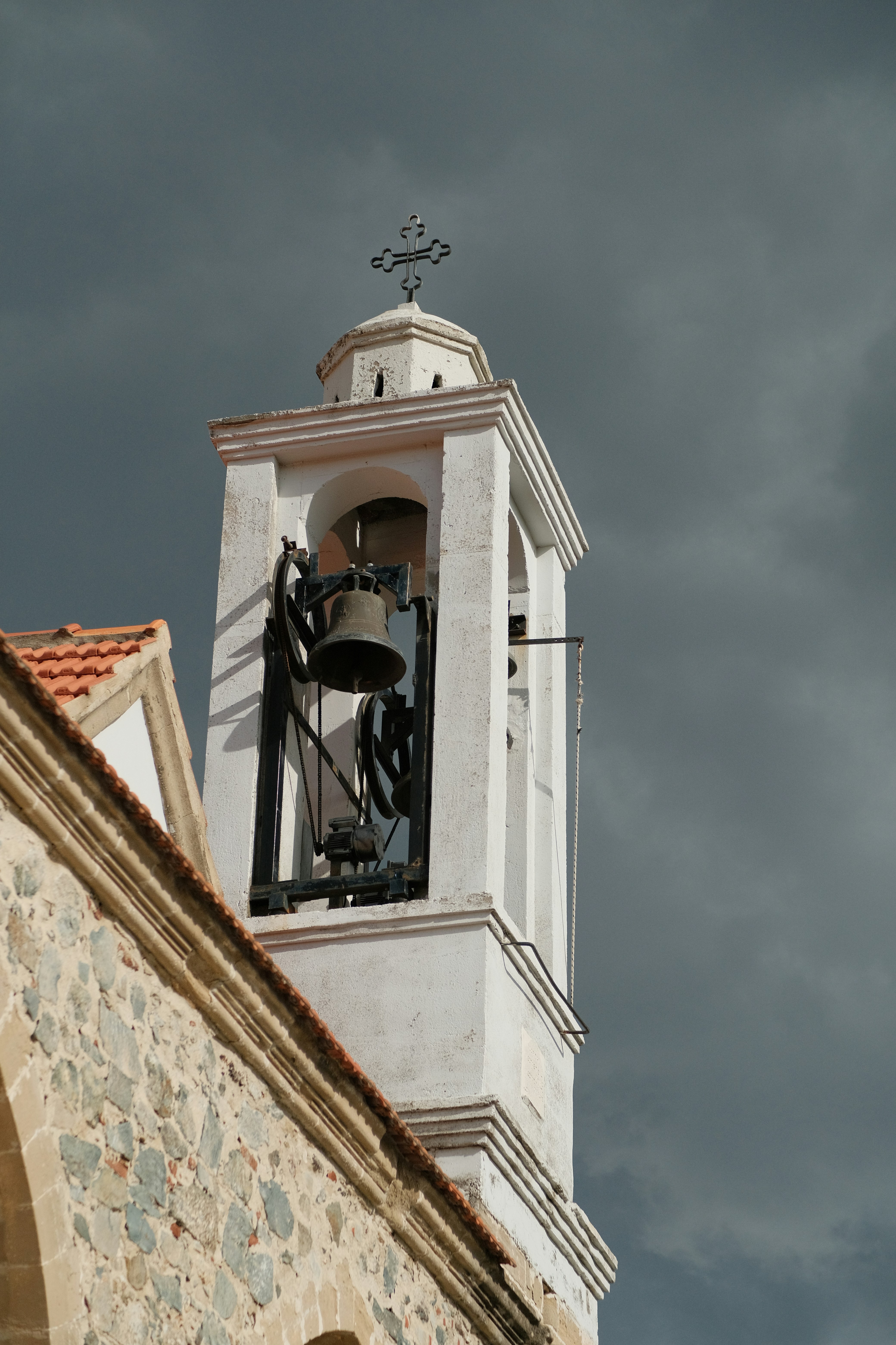 Solitary Bell Tower Rising Against a Looming Storm