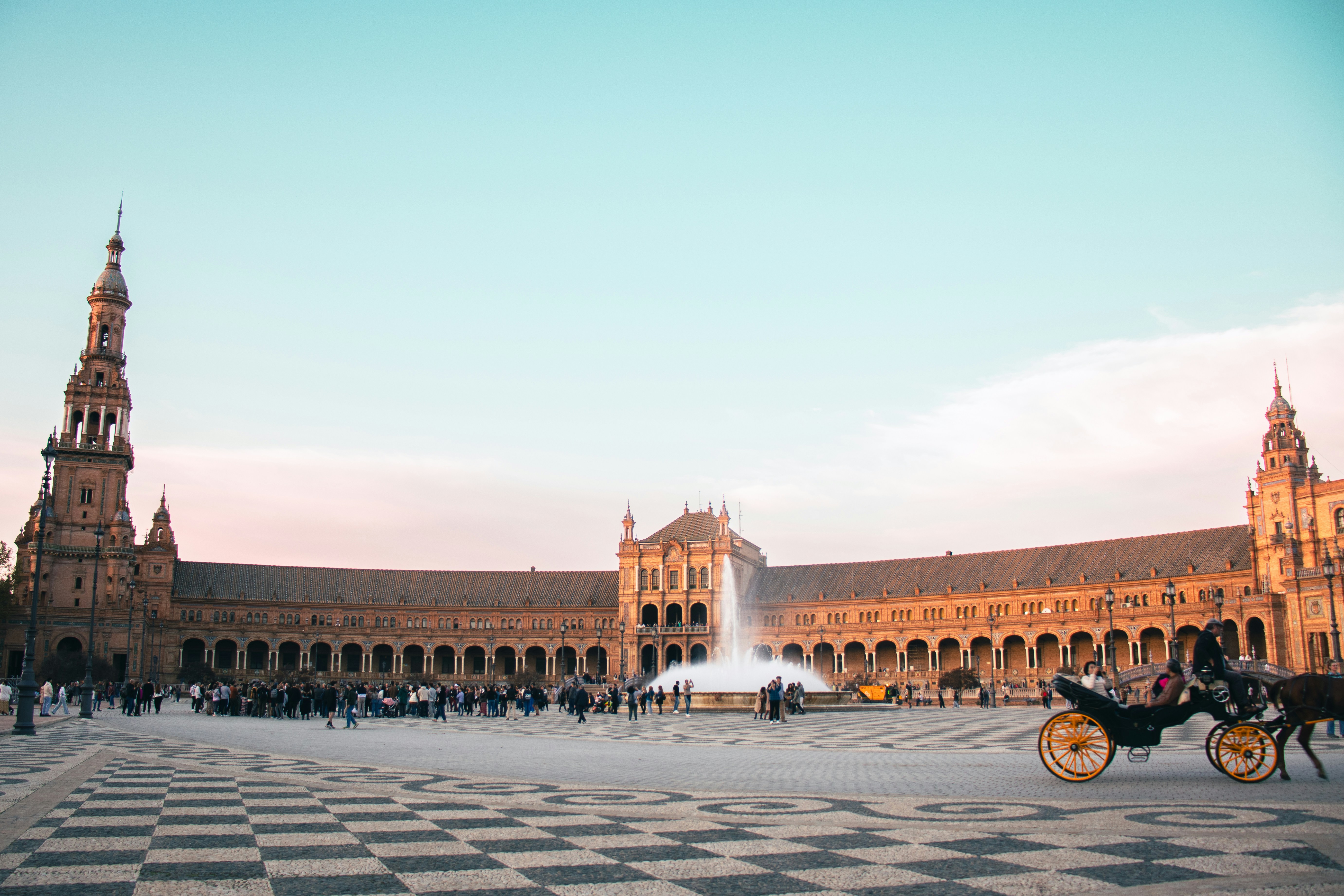 Midday Light over Seville's Arcaded Plaza: Fountain Centerstage
