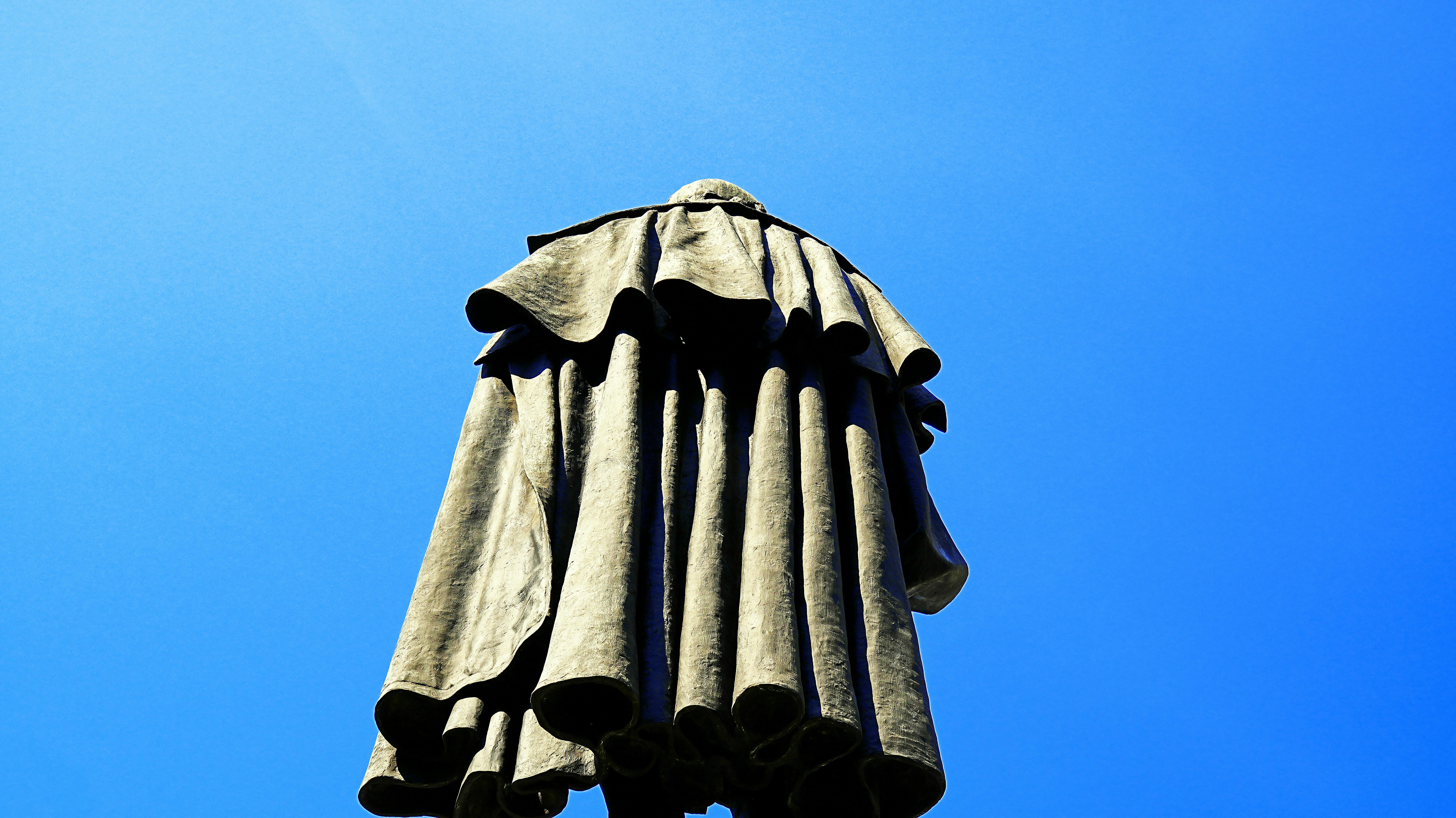 Folded Parasol Against a Cobalt Sky