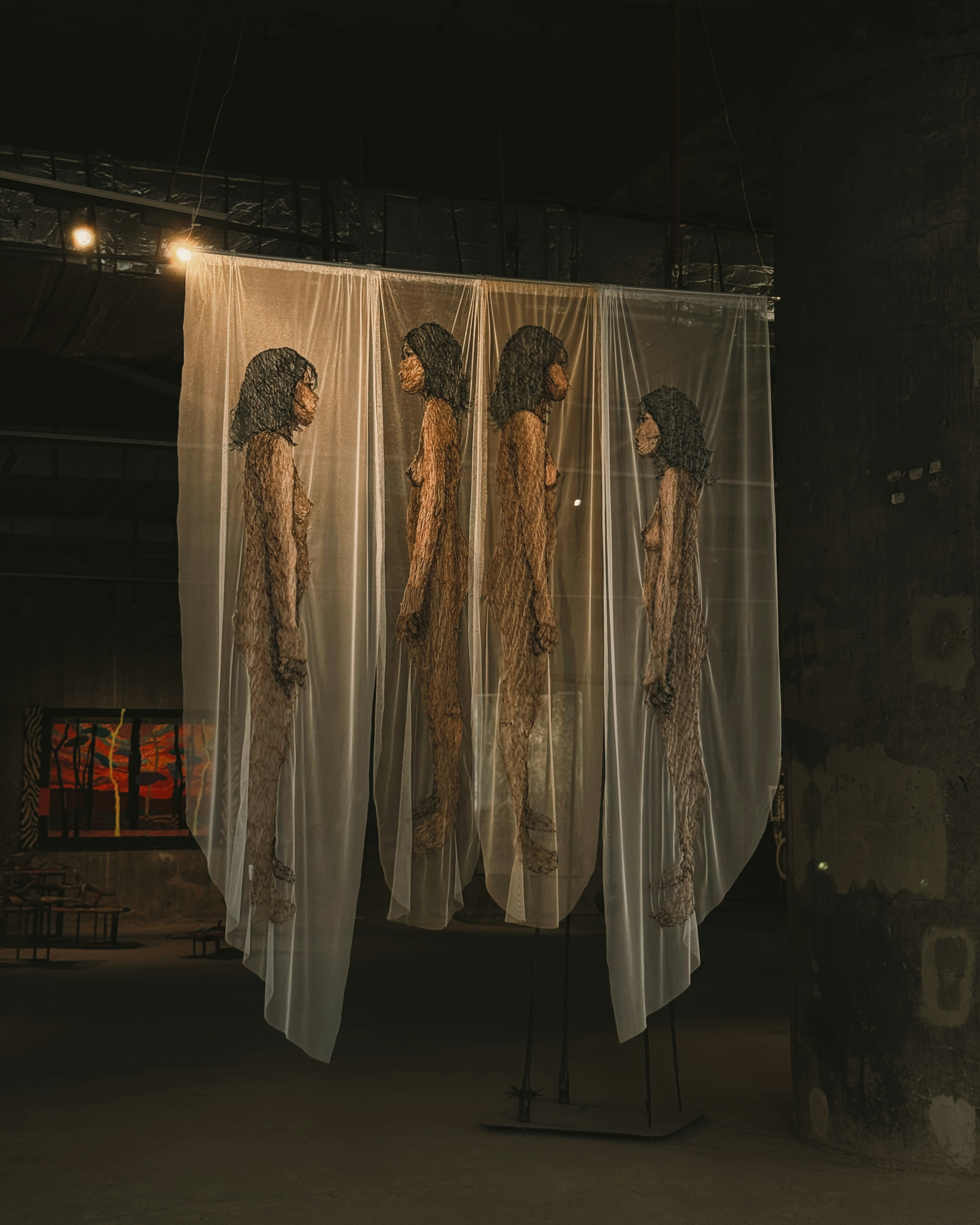 Curtained Echoes: Four Silhouettes Suspended in a Quiet Gallery