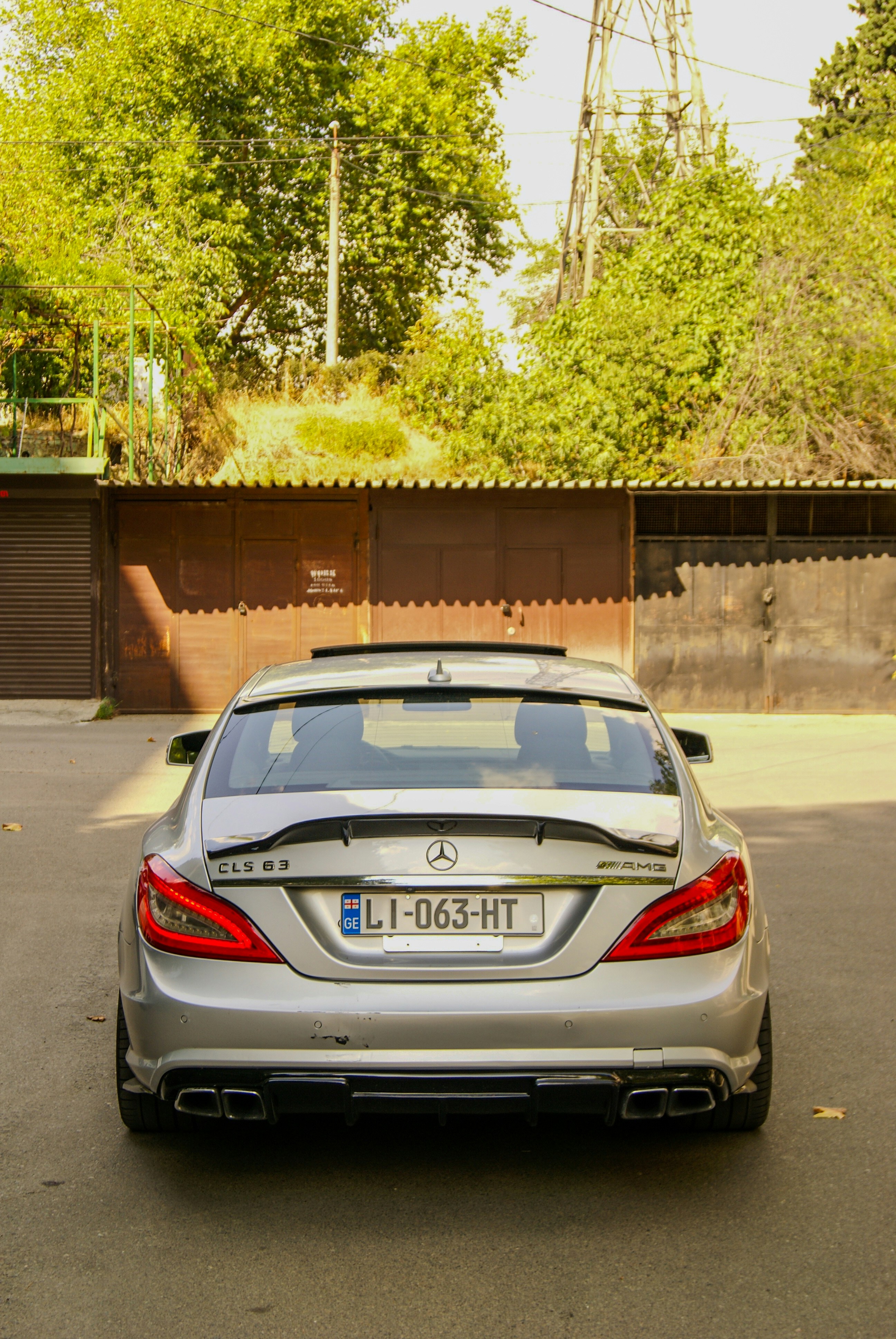 Midday Tail: Mercedes AMG CLS 63 in a sunlit industrial backlot