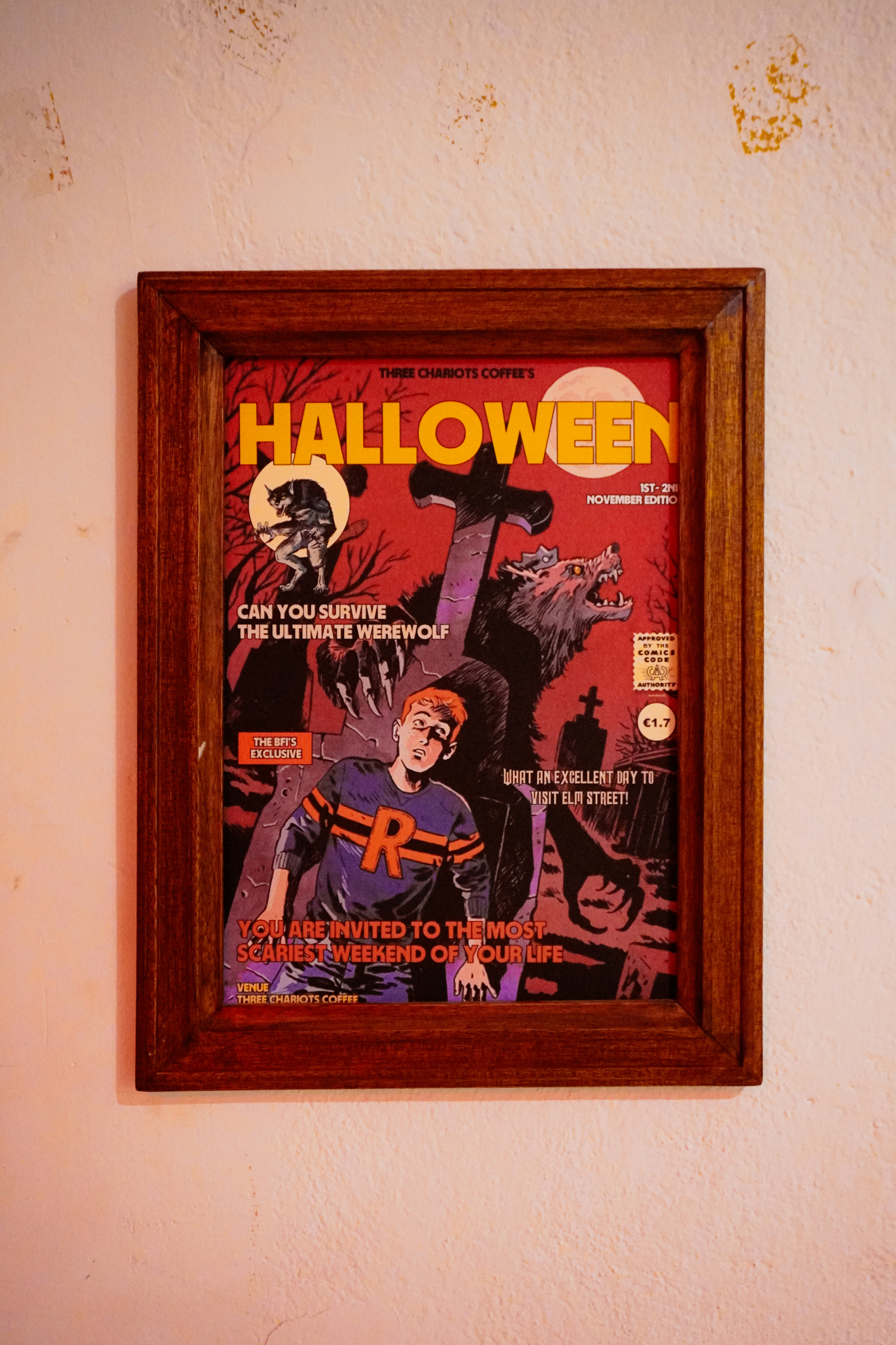 Amber-Lit Framed Halloween: A Retro Comic Poster on a Peach-Washed Wall