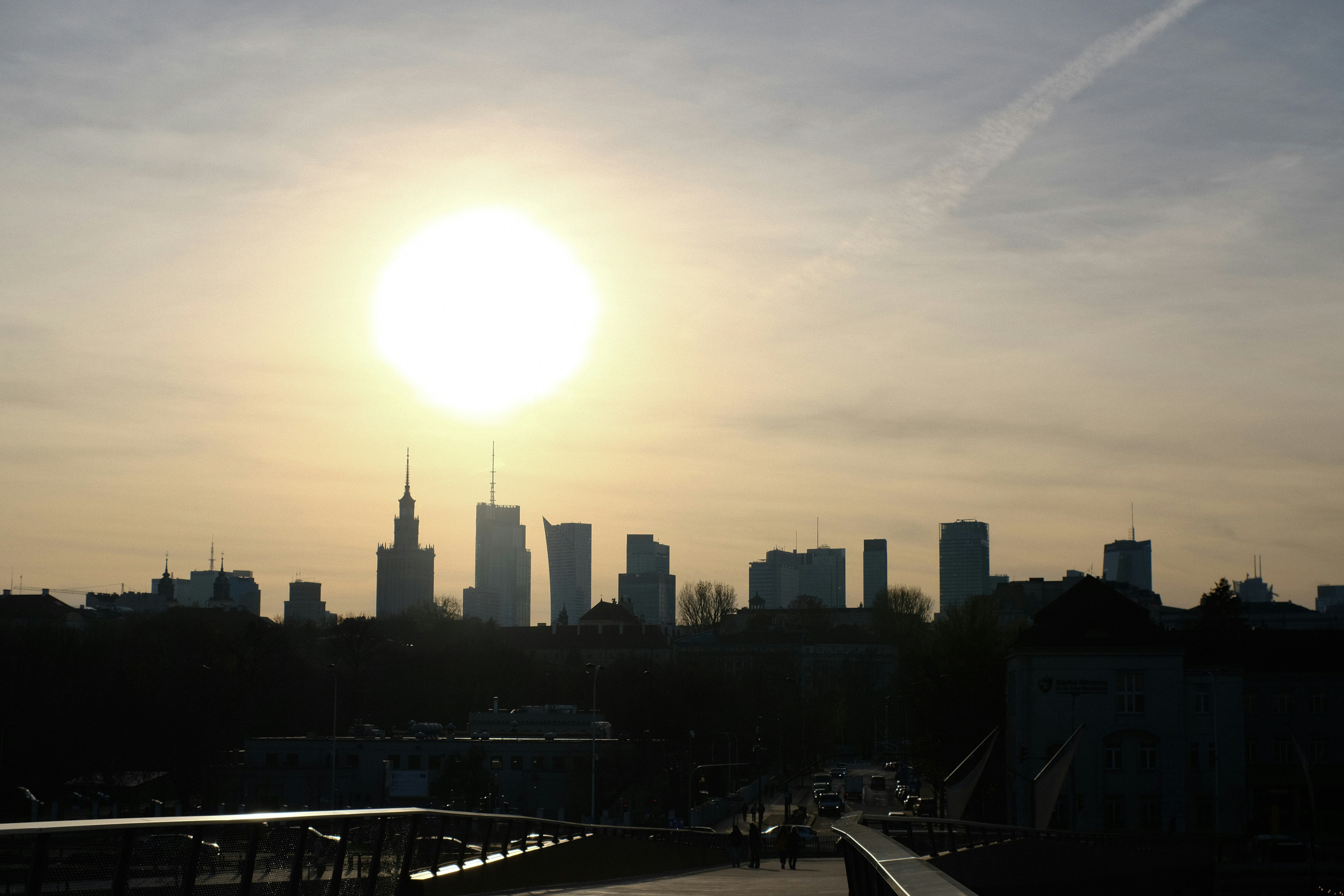 First Light Over a Silhouetted City: The Bridge Framing Dawn-Toned Towers