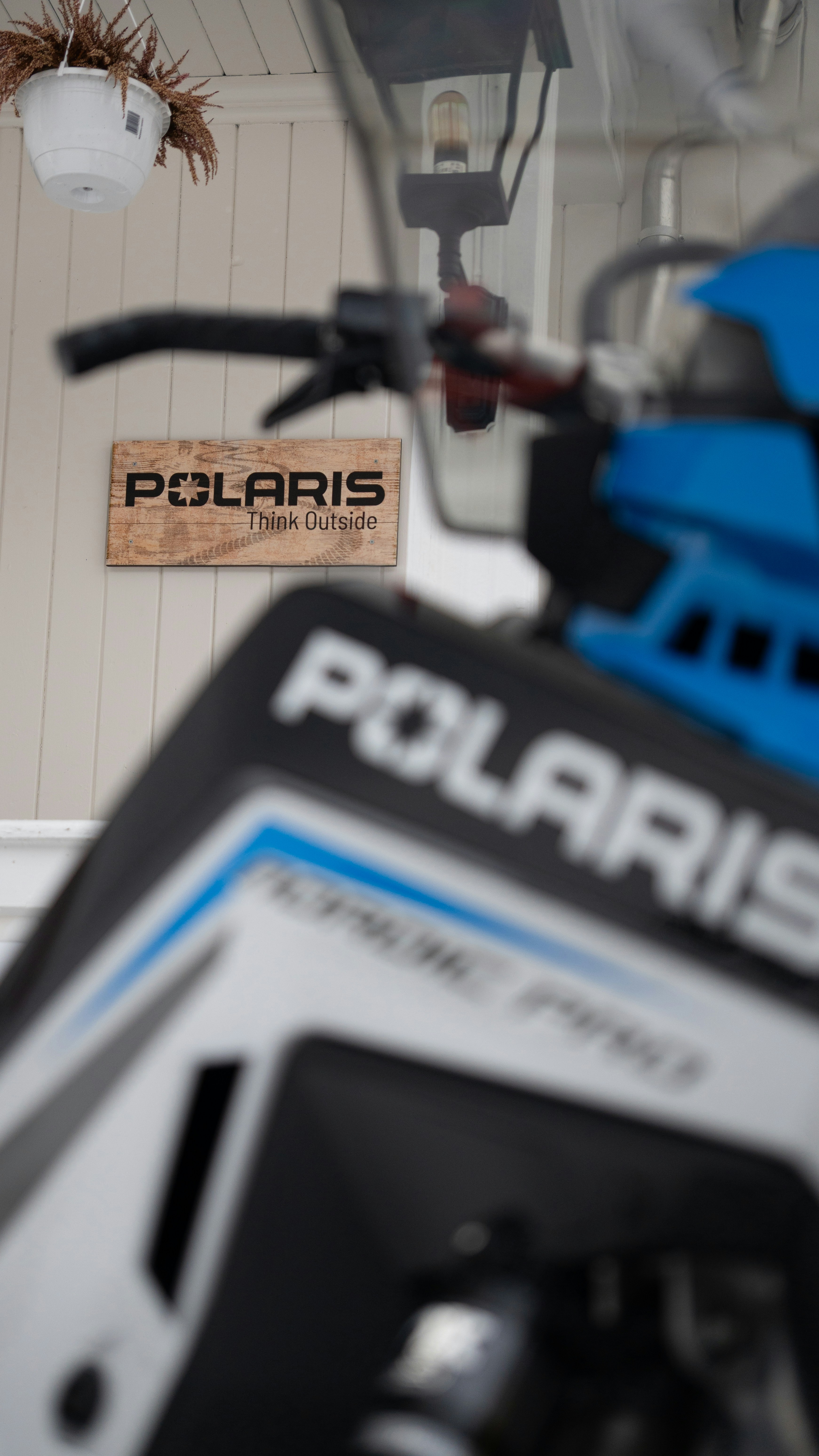 Think Outside: Polaris Sign Anchors a Garage Scene Framed by Blur