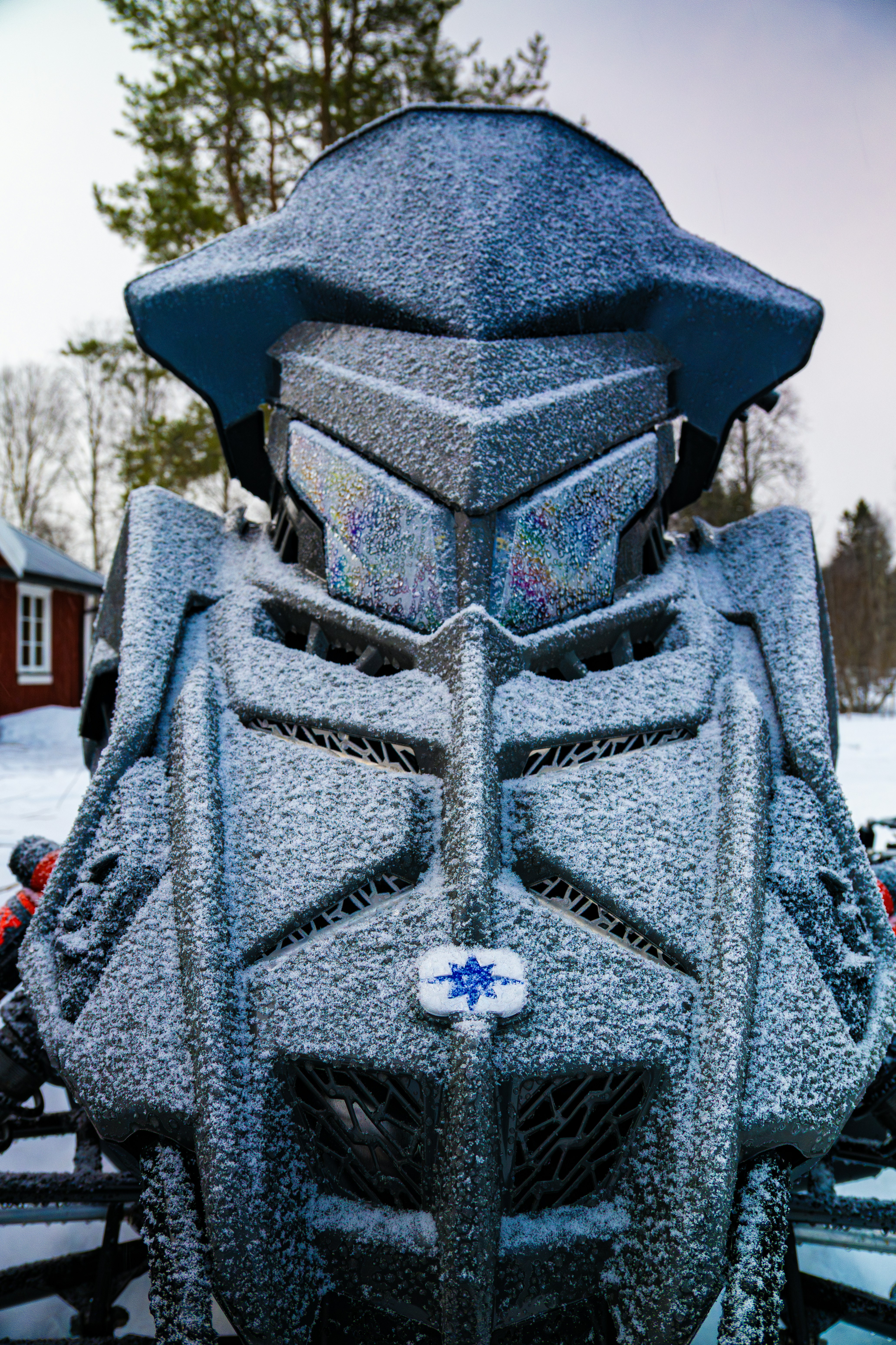 Frost-Crowned Front Armor: A Snowmobile Pierces Winter Quiet
