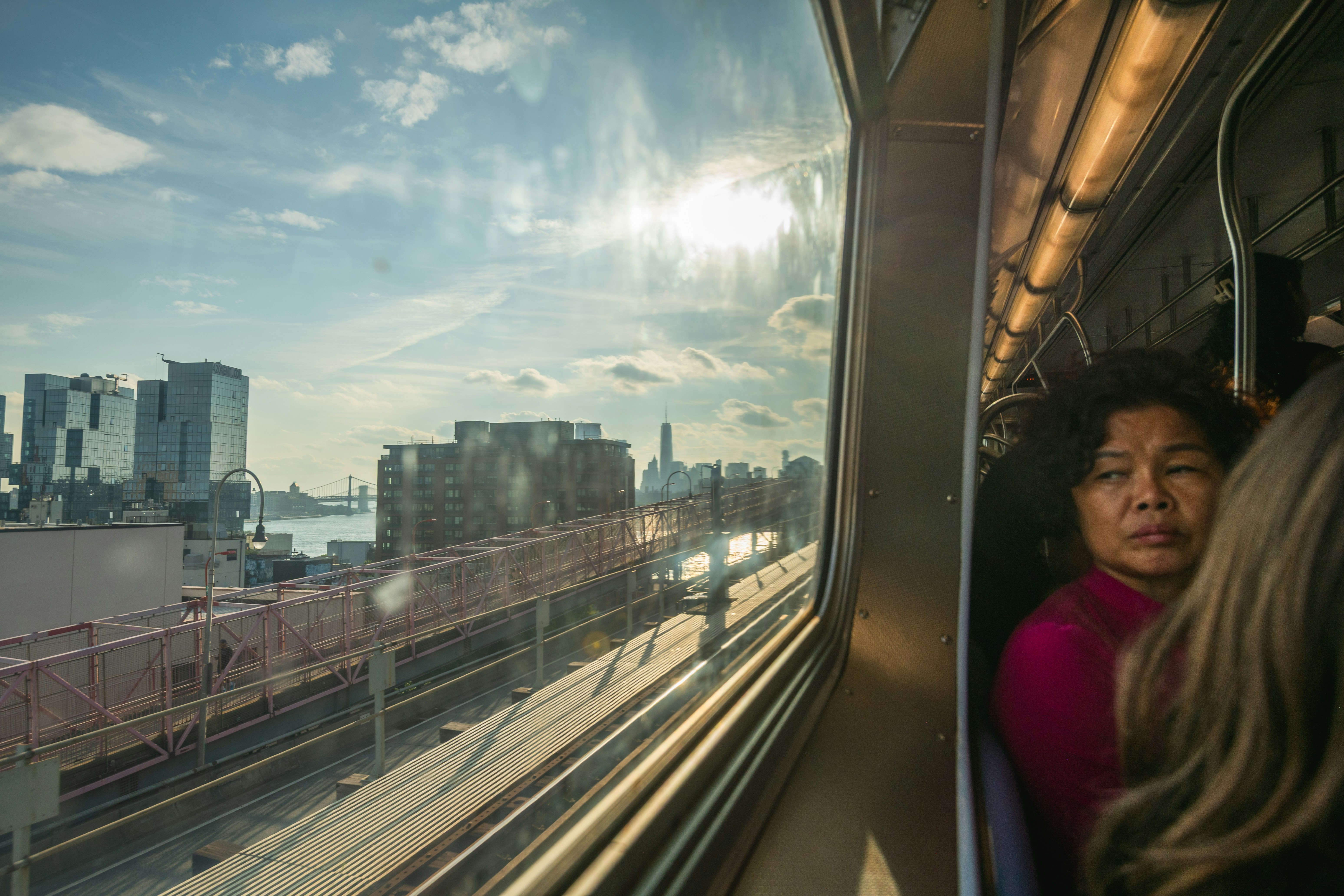Window Seat Portrait: A Pink Top and a City in Transit