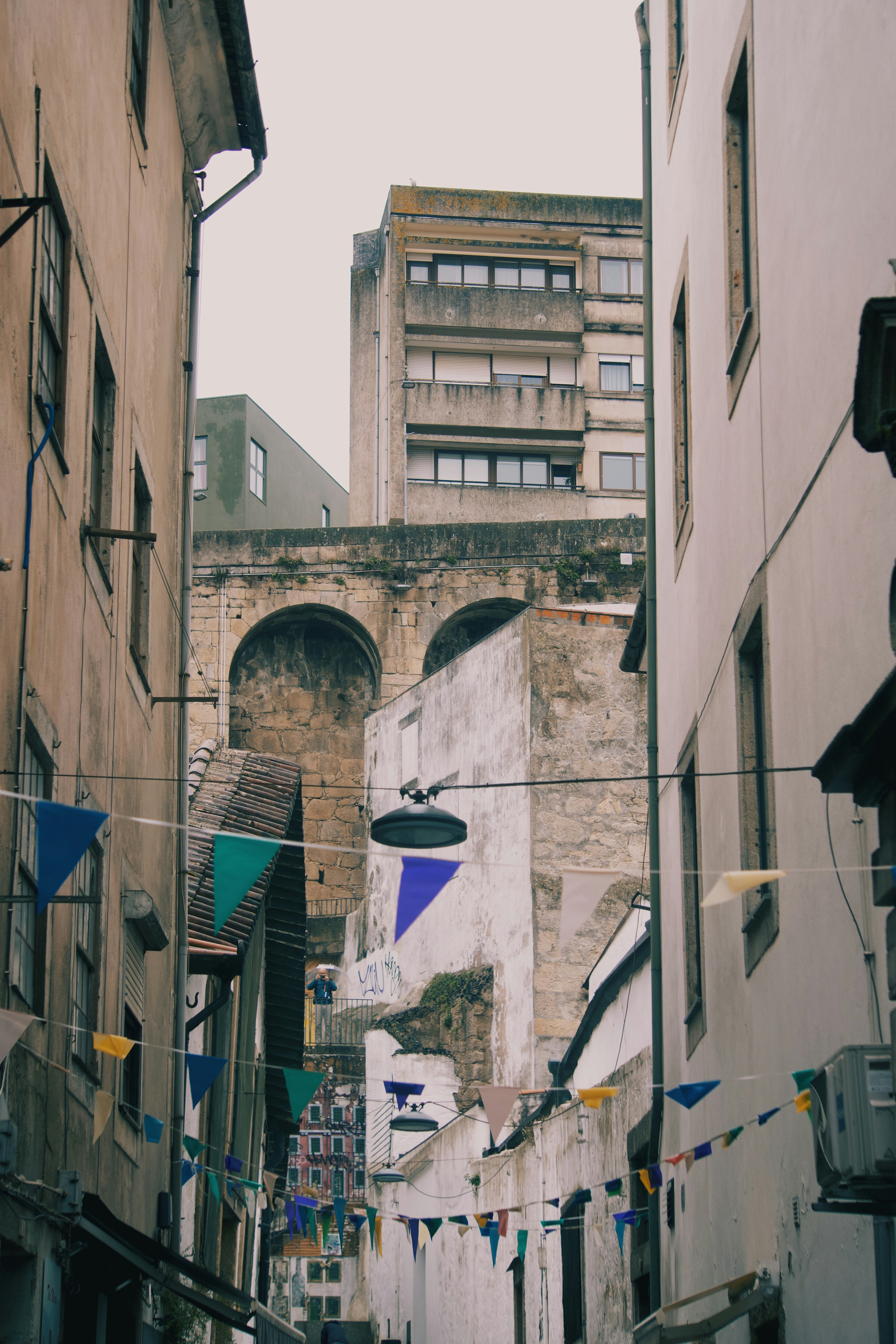 Colored Flags Against GreyEmmanuel Awotunde