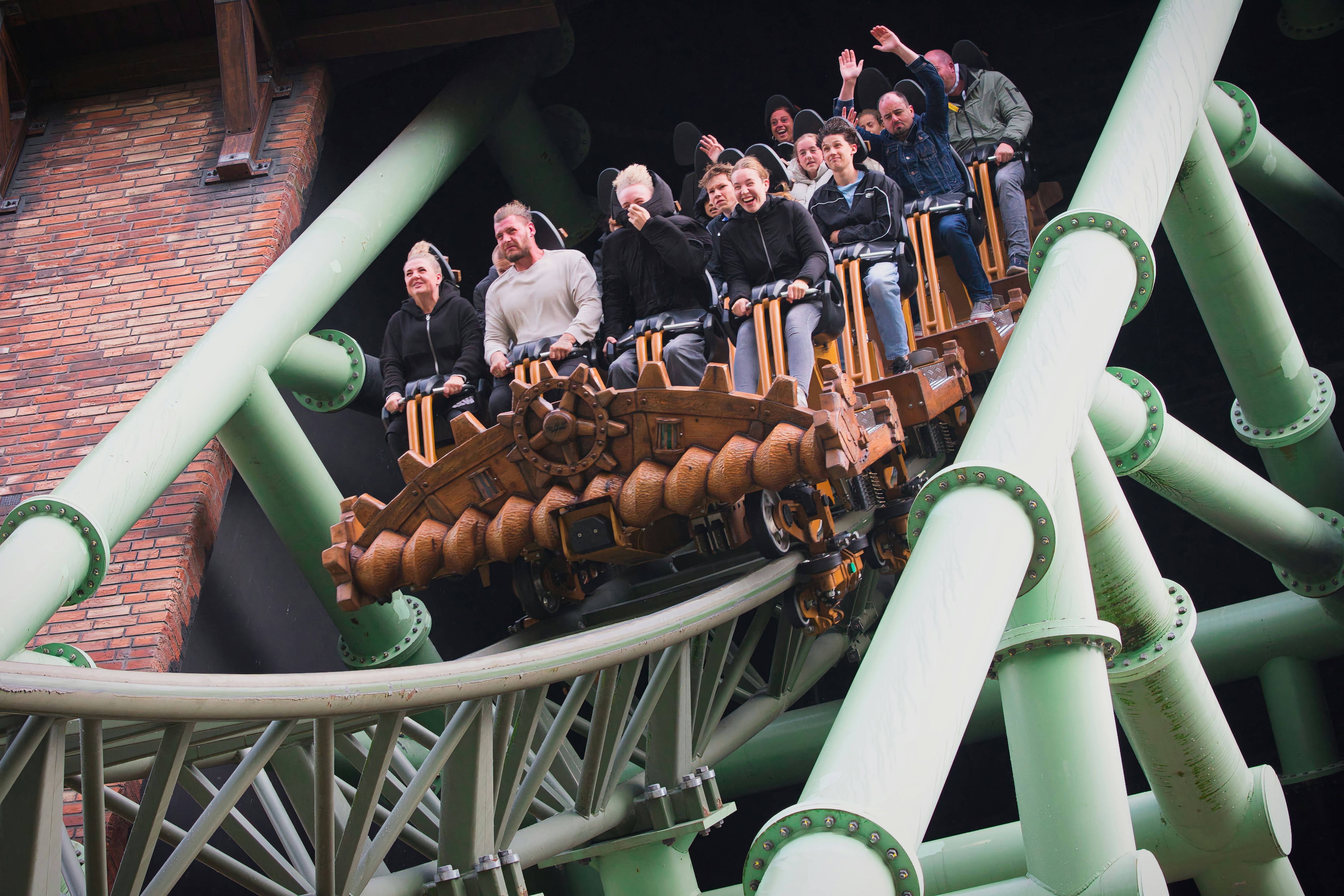 Gripping Turn: Riders Lean Into a Verdant Coaster
