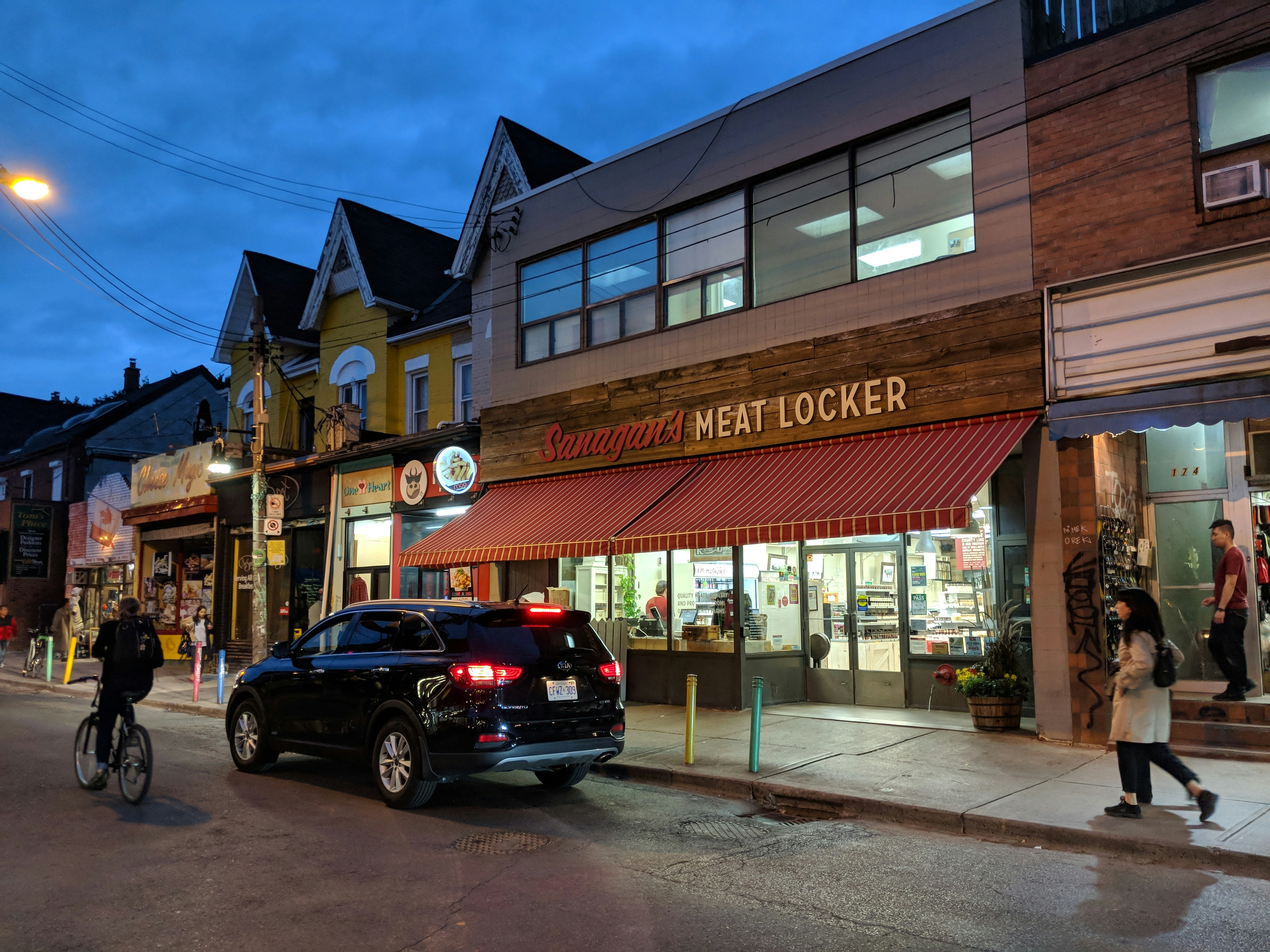 Street scene with a meat locker store at dusk