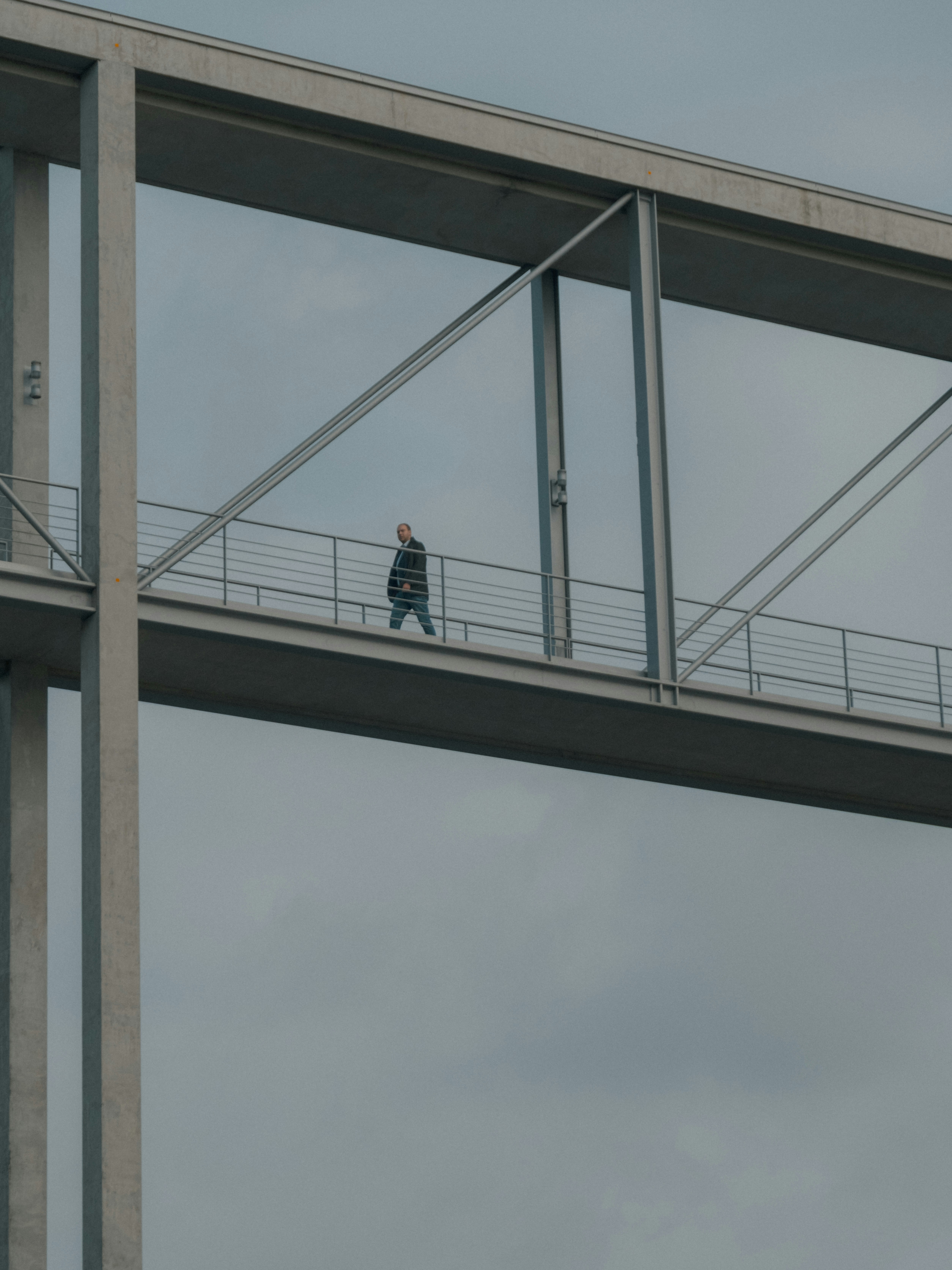 A person walks on a modern elevated walkway photo – Free Transportation ...