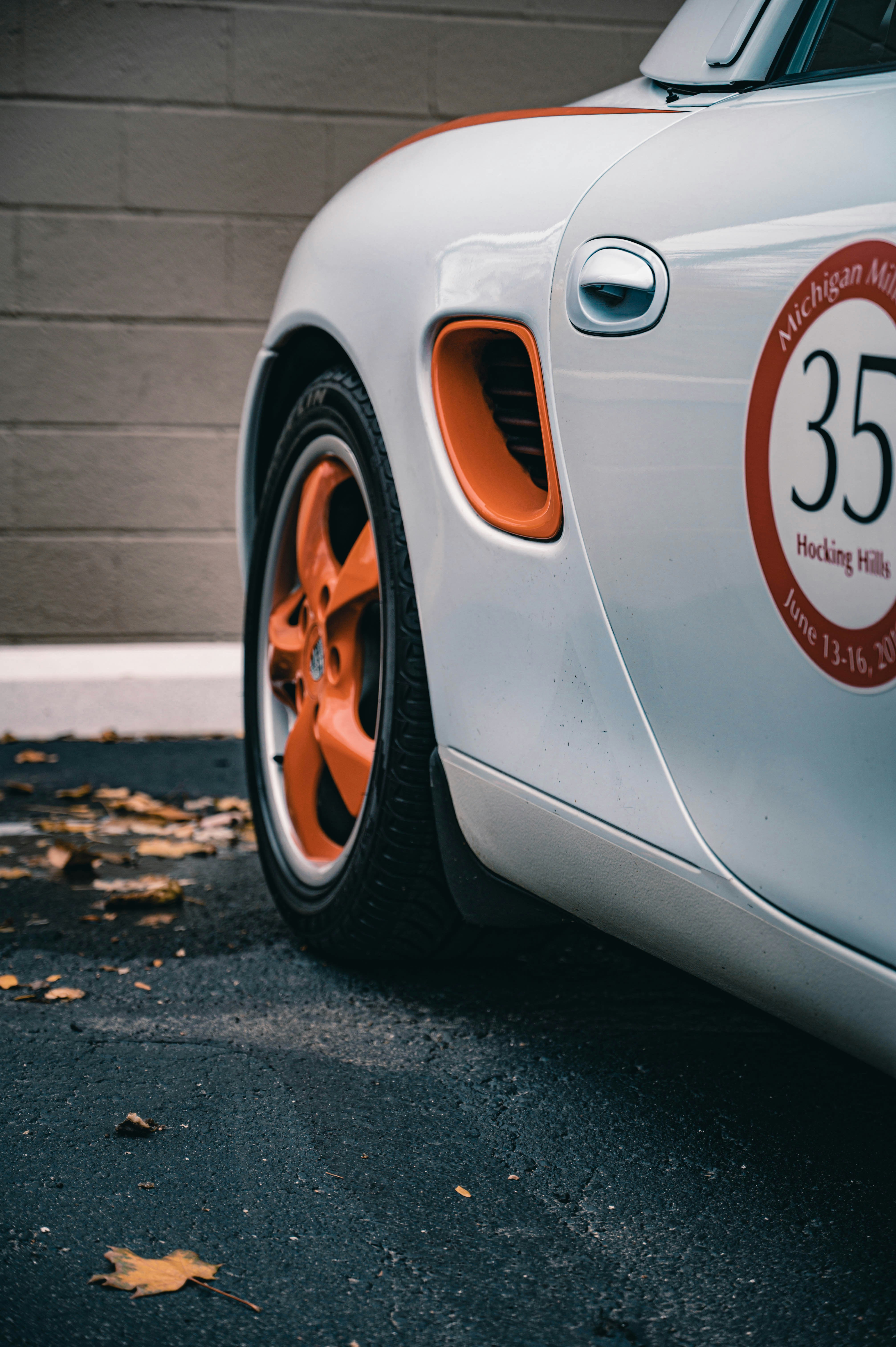Orange Vent and White Racer: A Quiet Close-Up of a Classic Sports Car