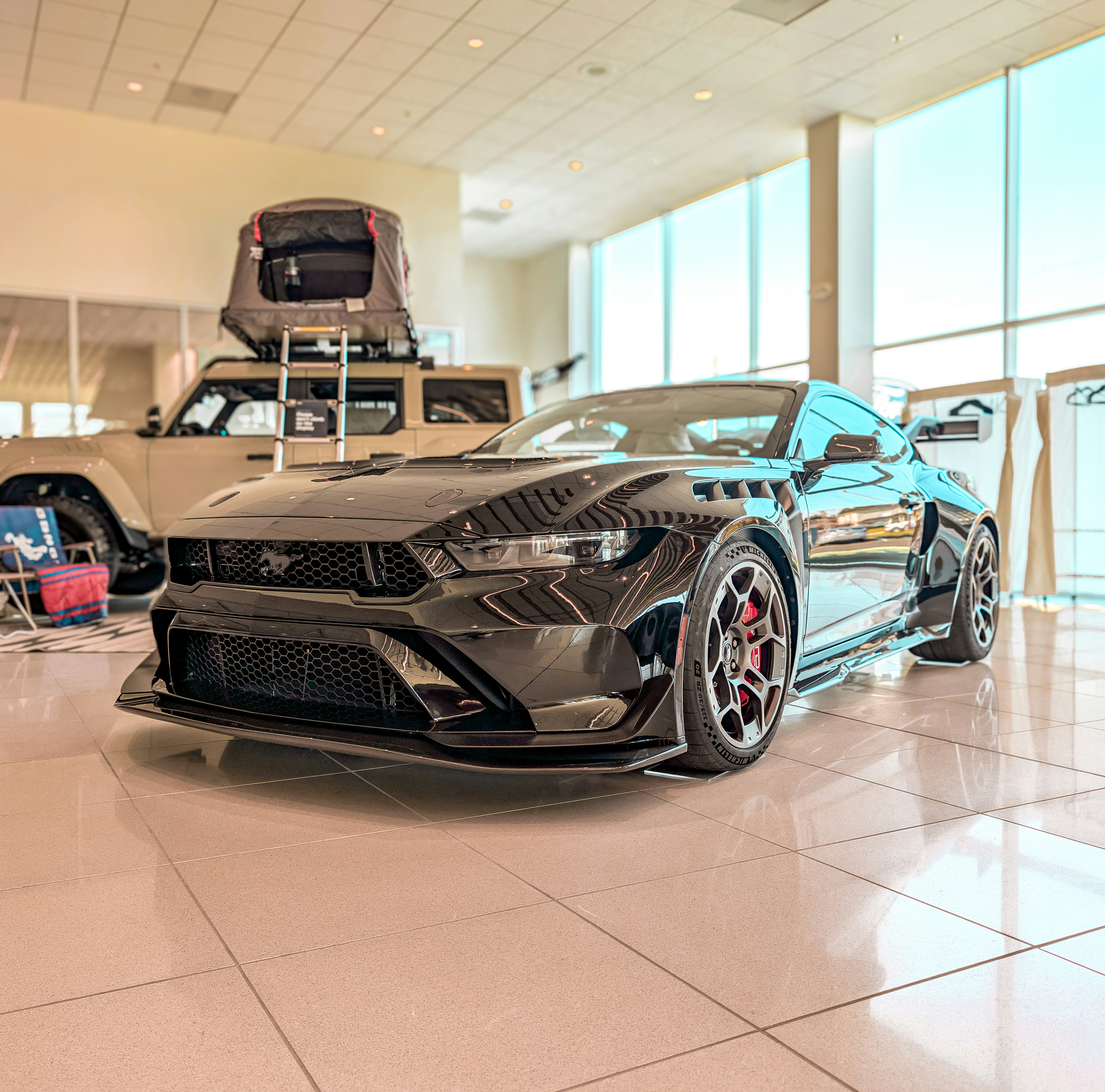 Standing proud in the showroom, this Mustang GTD is an undeniable masterpiece. The aggressive widebody and massive front splitter give it a dominating, incredibly potent stance, promising pure, visceral performance.
