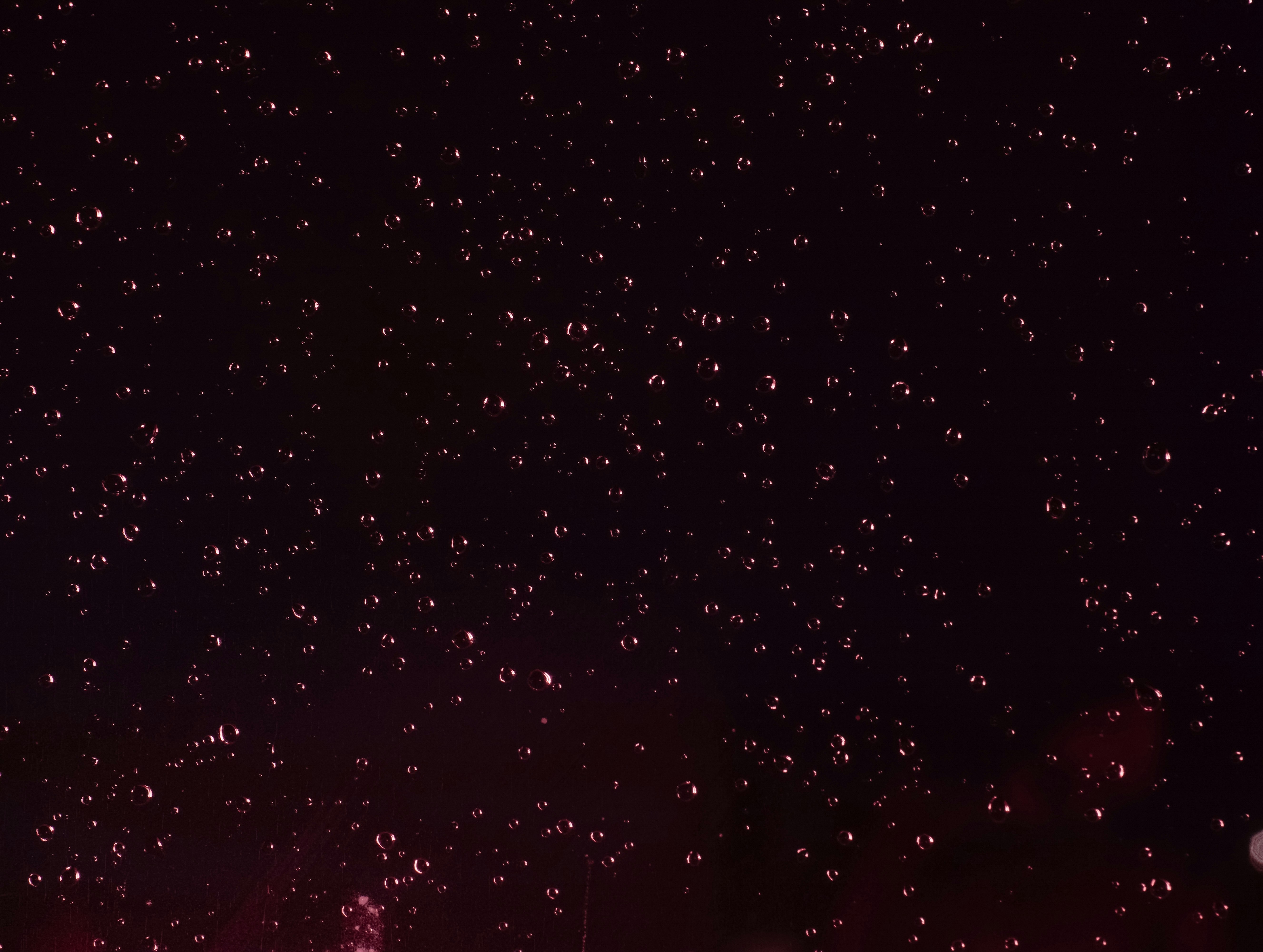 Raindrops against a window in Foggy Bottom.