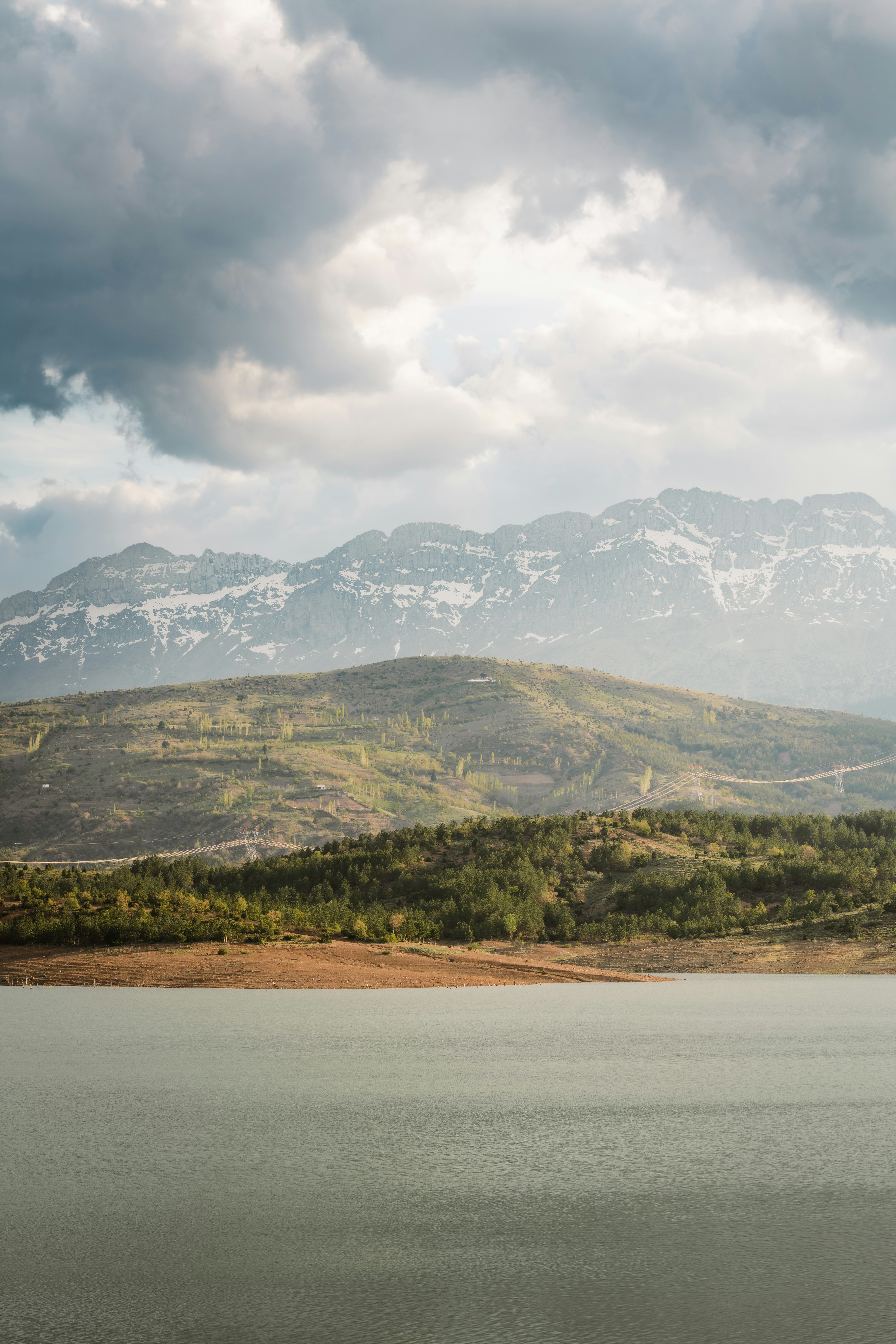 Tranquil Lake Beneath Stormy Clouds
