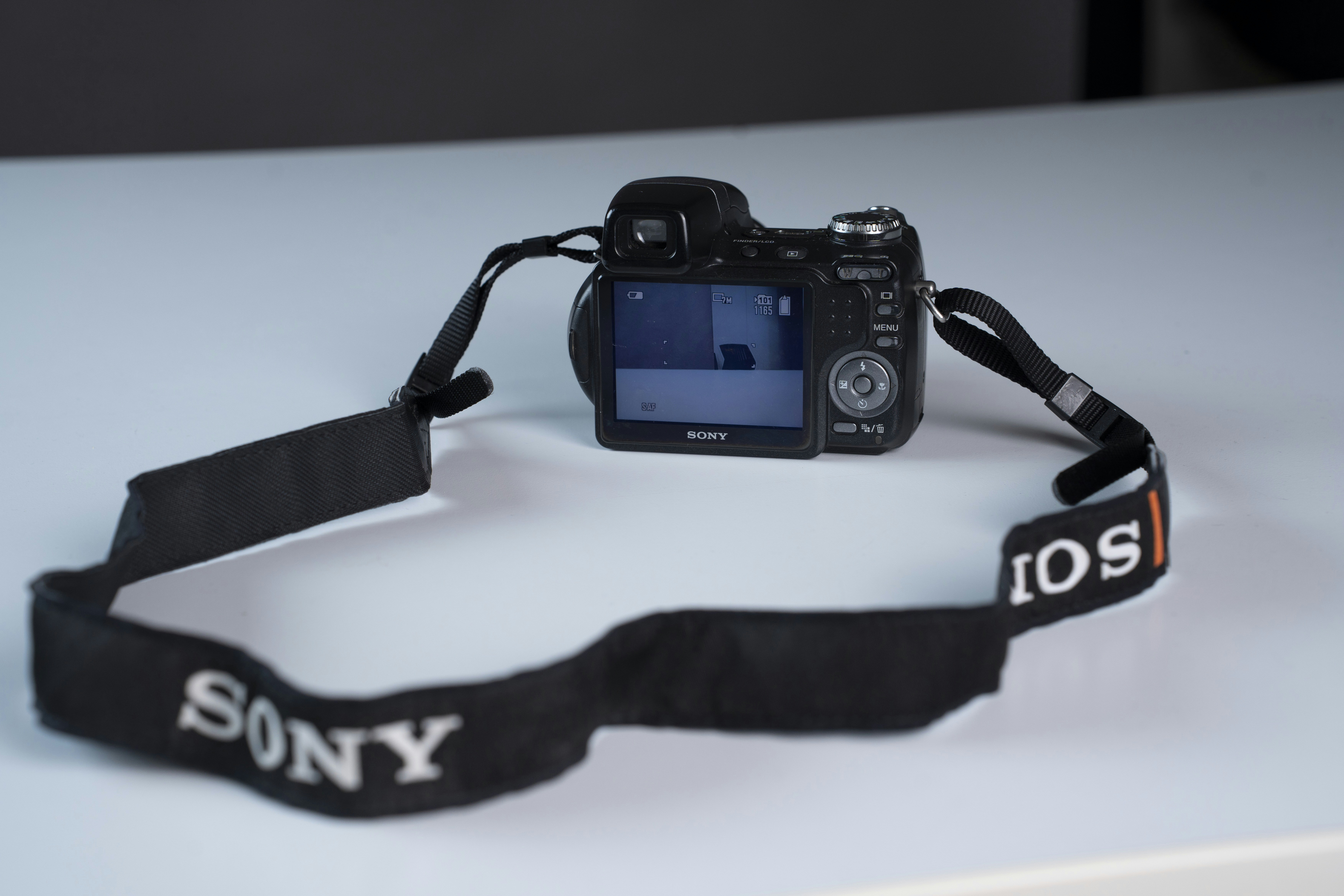 Quiet Precision: The Sony Alpha 7C II on a Soft Blue Studio Surface