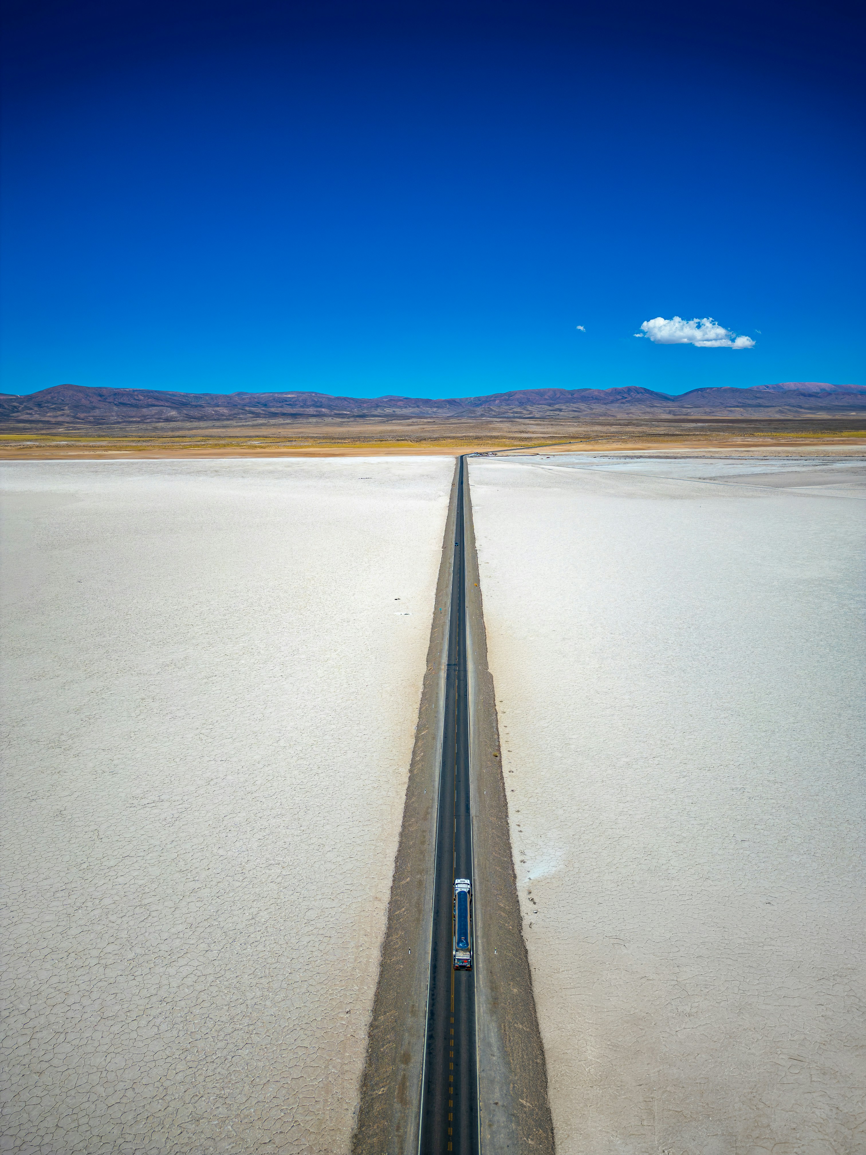 Vanishing Saltline: A Narrow Canal Carving the Desert's Mirror