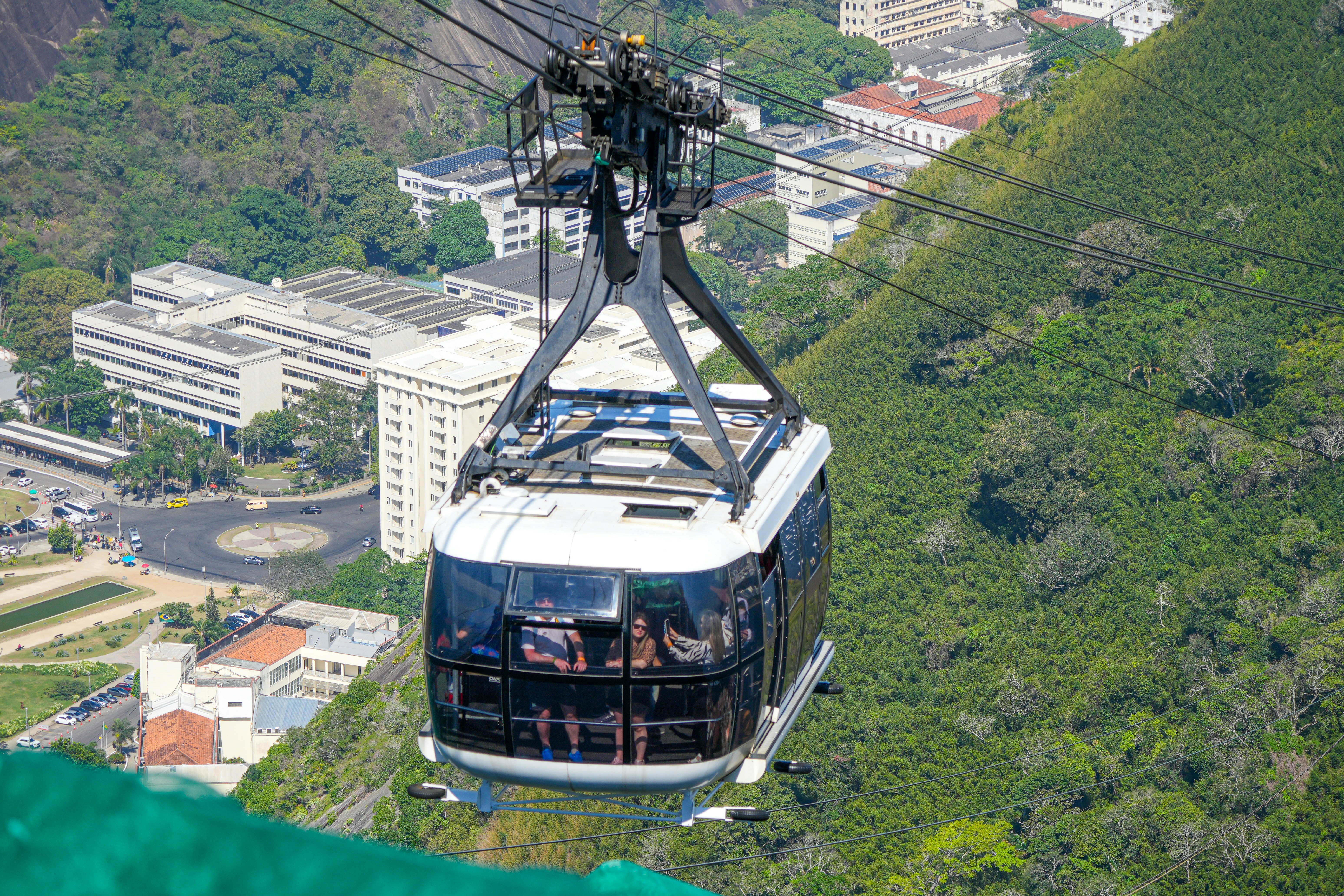Cable-car Vista: Glass Cabin Hovering Above a Verdant Canyon