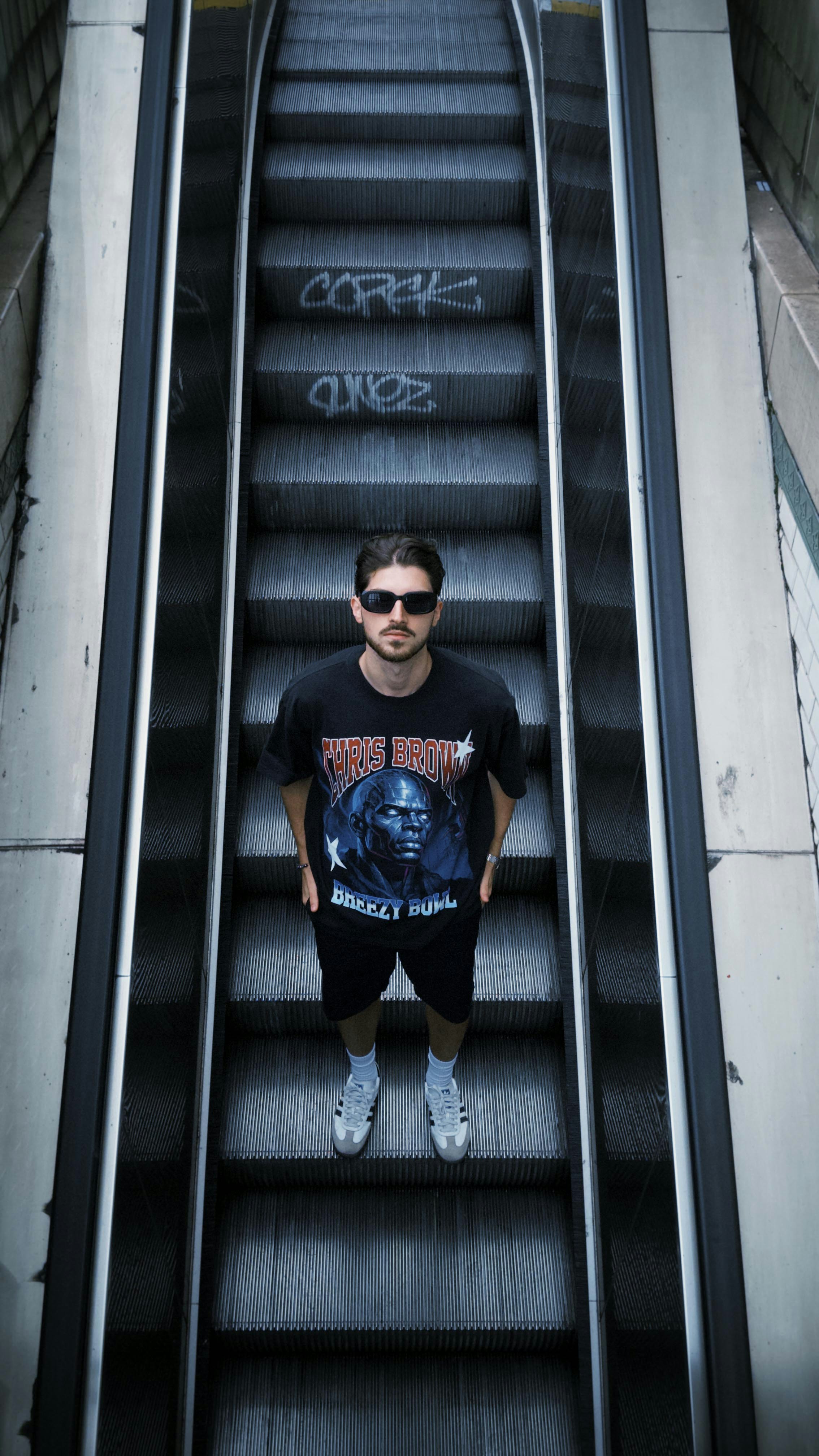 Stand at the Center: A Street-Style Portrait on an Upward Escalator