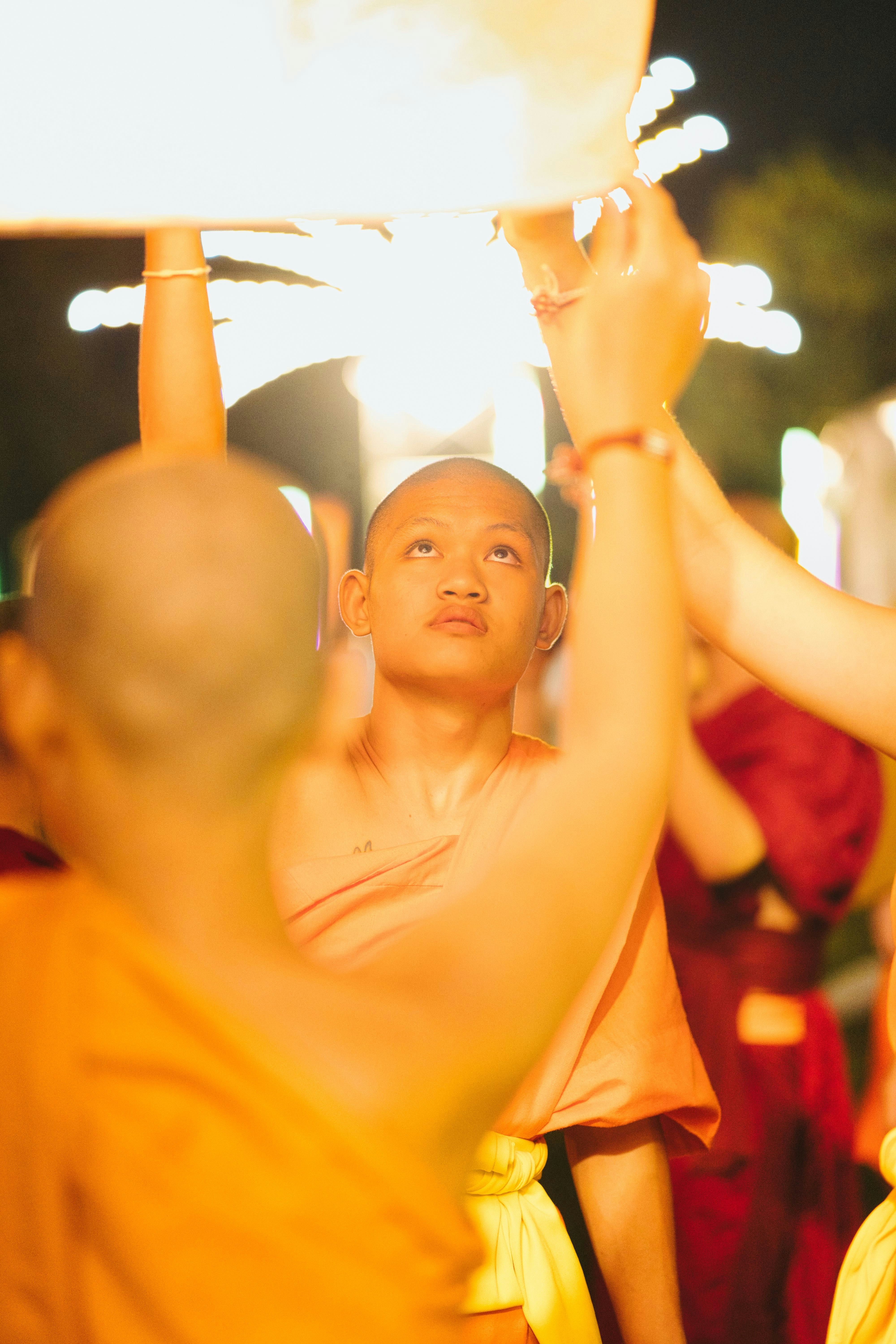 Lantern Lift at Dusk: A Monk's Candlelit Rite